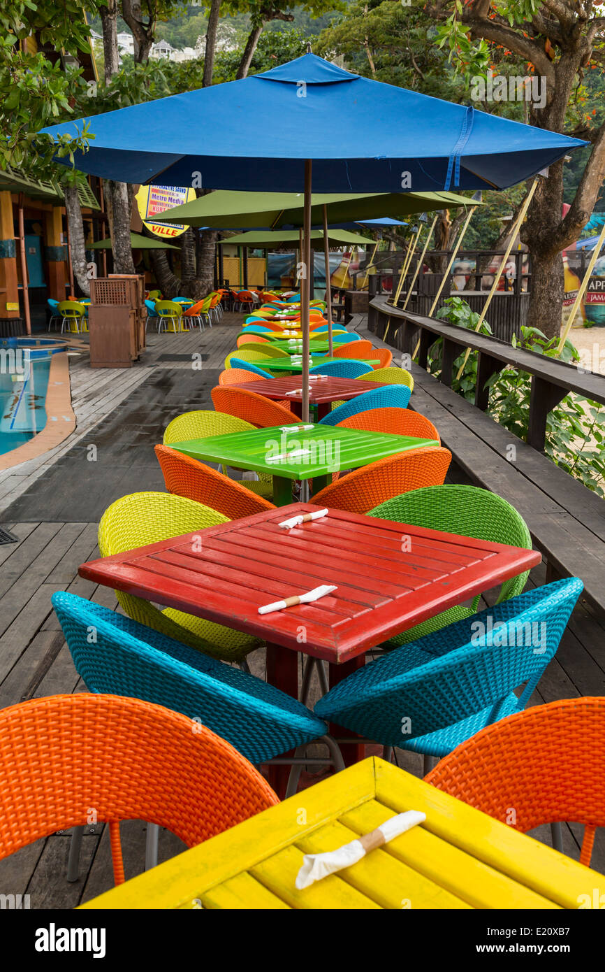 Colorful tables at an outdoor restaurant at the Island Village shopping ...