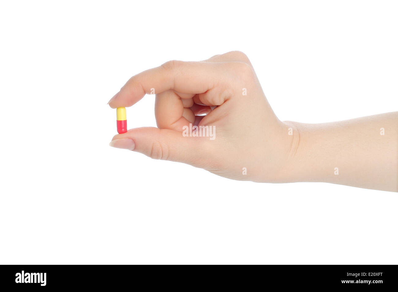 Hand with pill on white background Stock Photo - Alamy