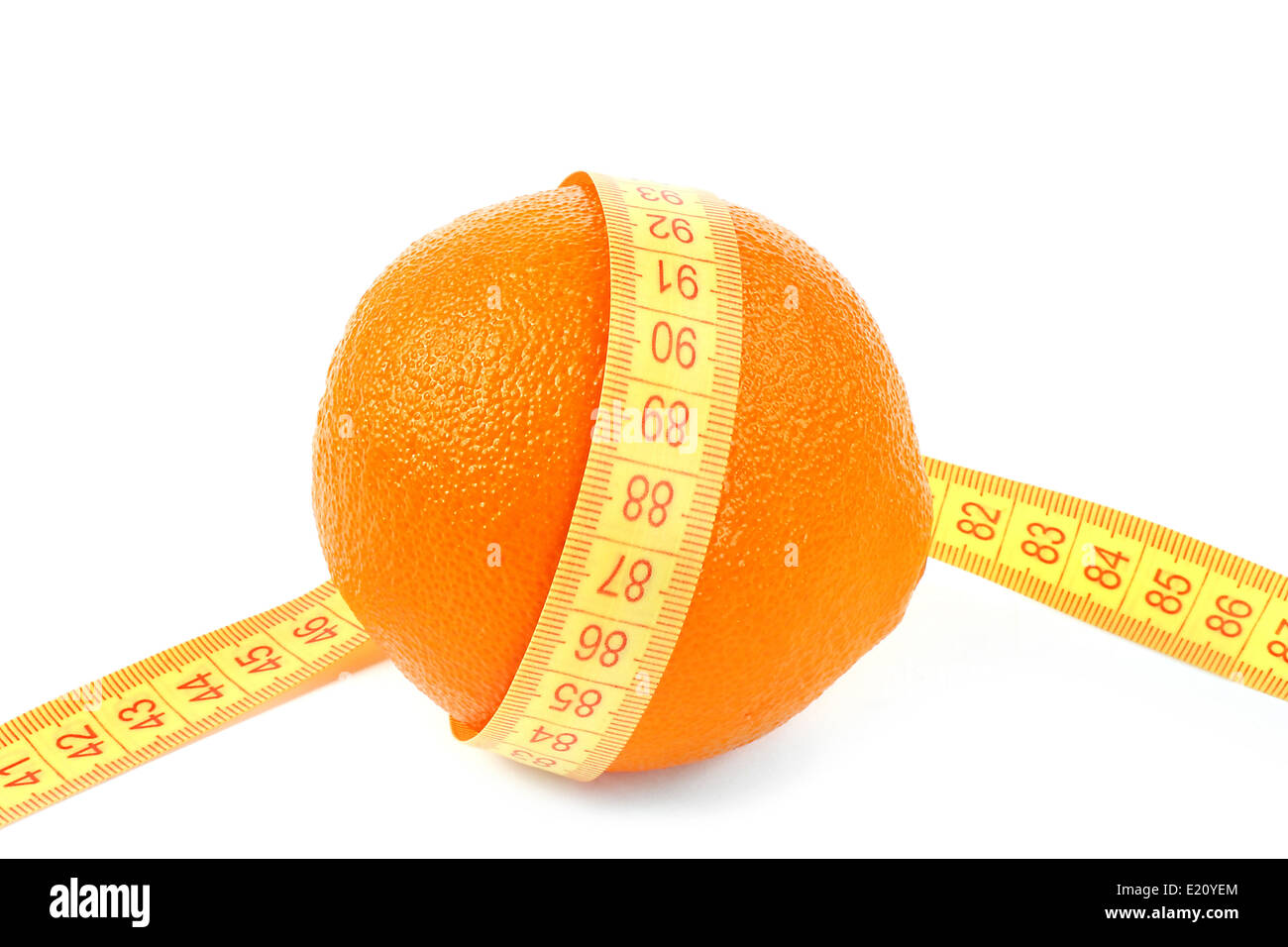 Orange fruit with tape measure on white background Stock Photo - Alamy