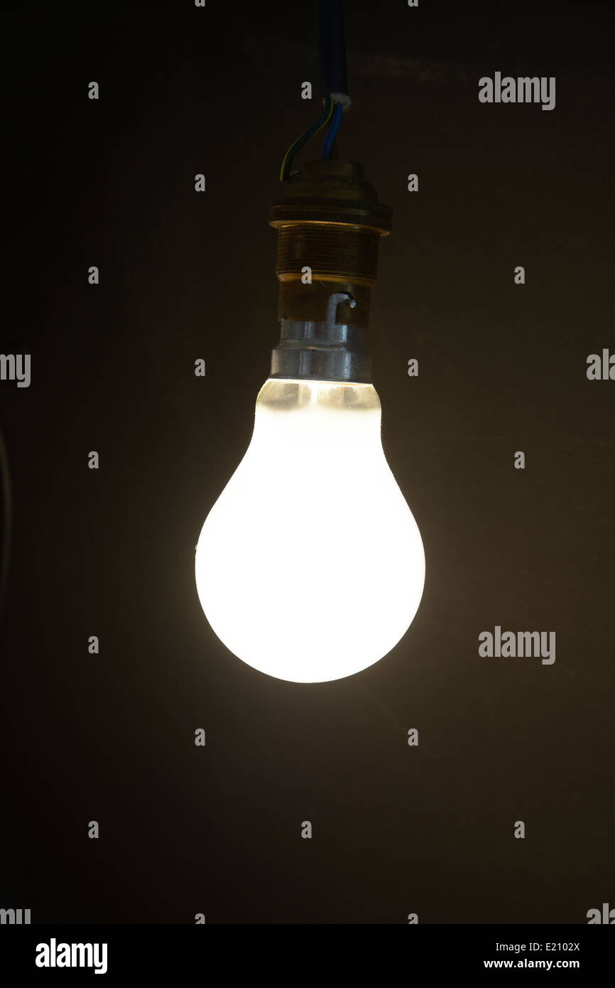 Electric light bulb. White pearl finish. Illuminated Stock Photo - Alamy