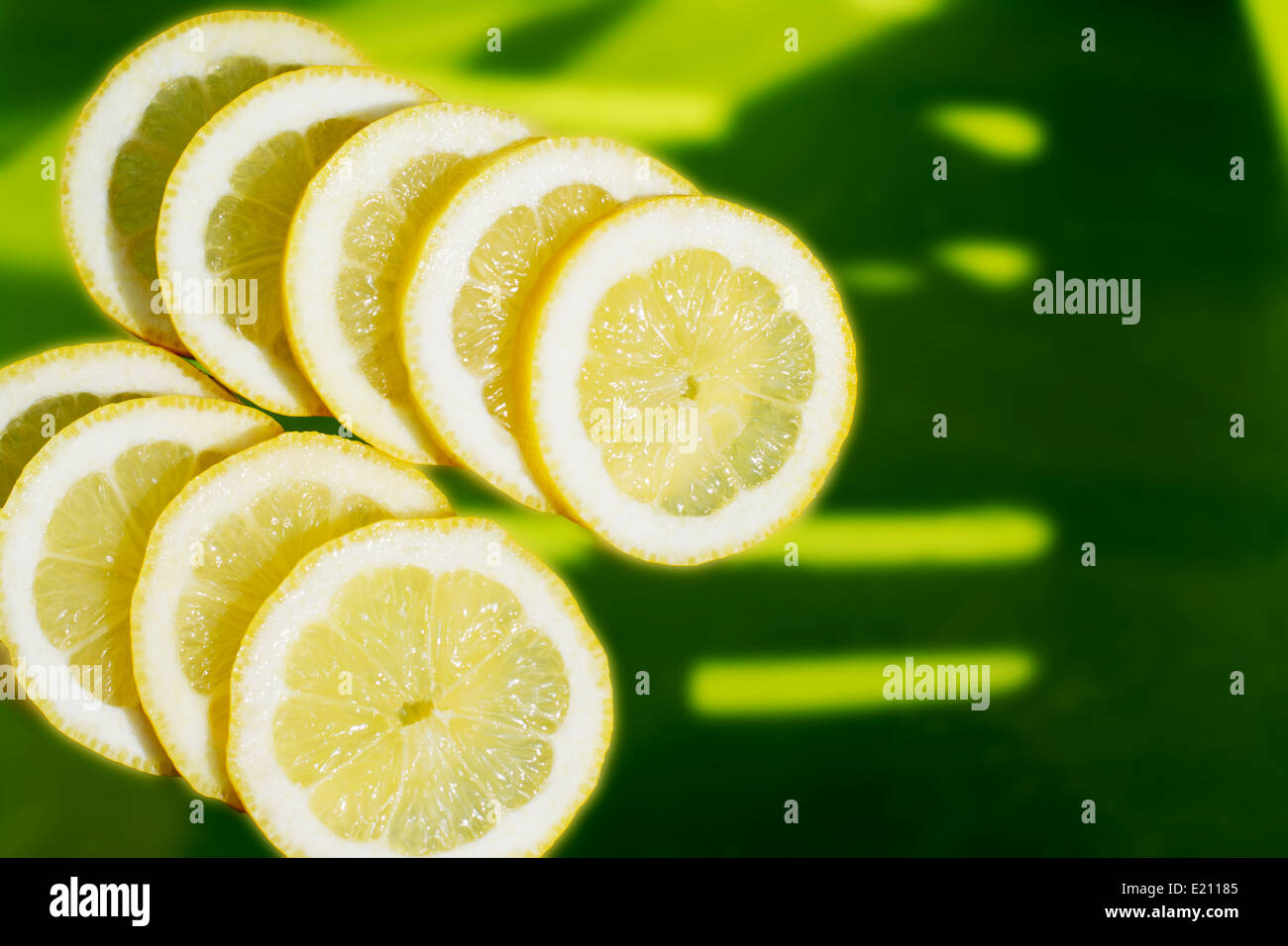 Sliced lemon with a summer background Stock Photo - Alamy