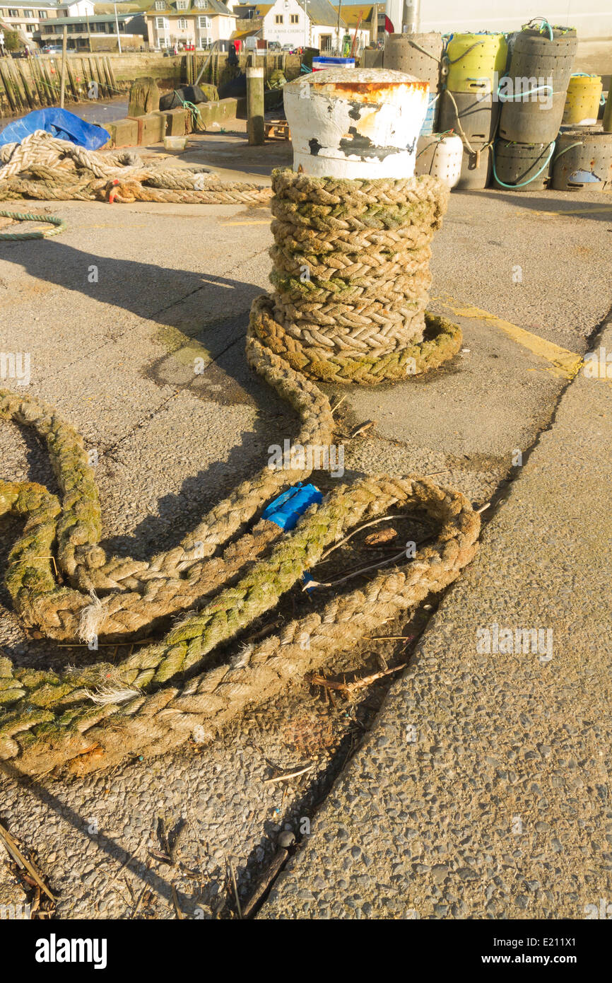 Thick Rope partially wound around ship’s mooring bollard, West Bay ...