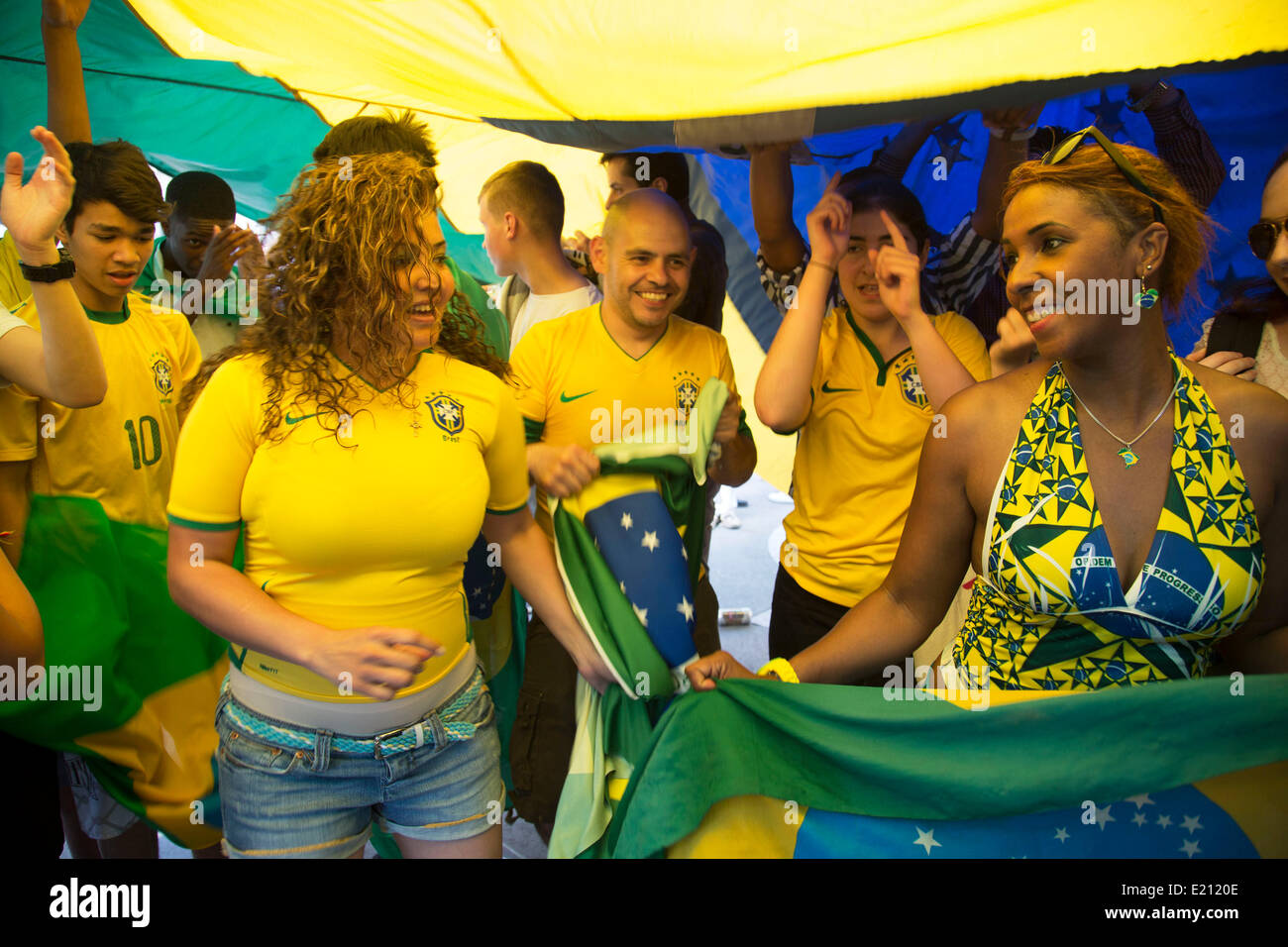 London, UK. Thursday 12th June 2014. Dancing and singing in joy ...
