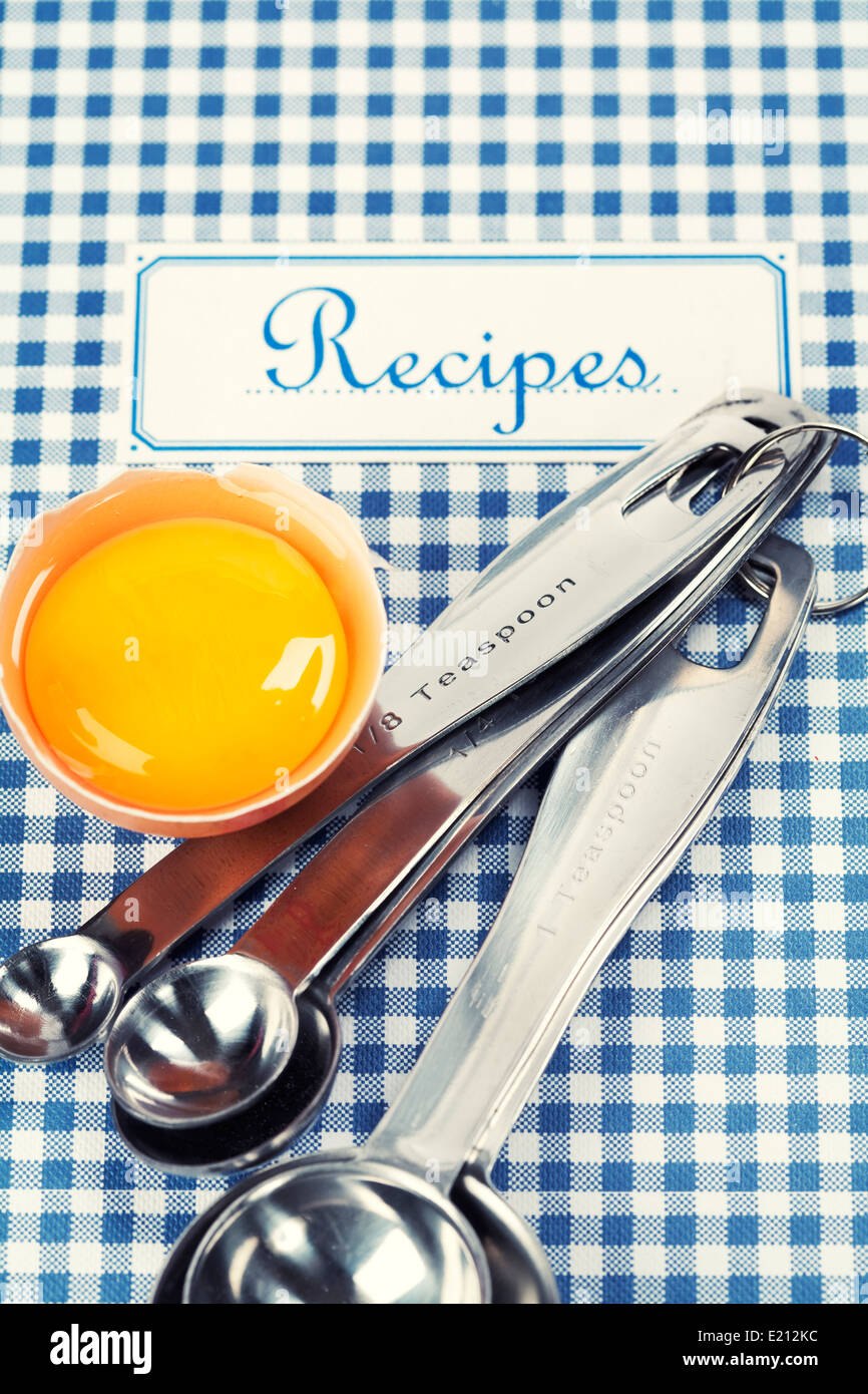 Blue cookbook and kitchenware Stock Photo - Alamy