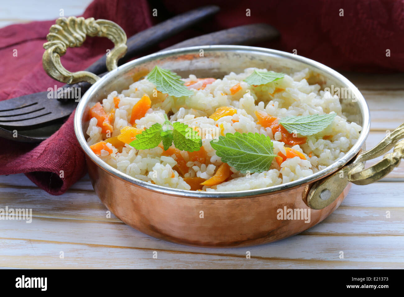 rice with vegetables cooked in Indian style in a copper pan Stock Photo ...