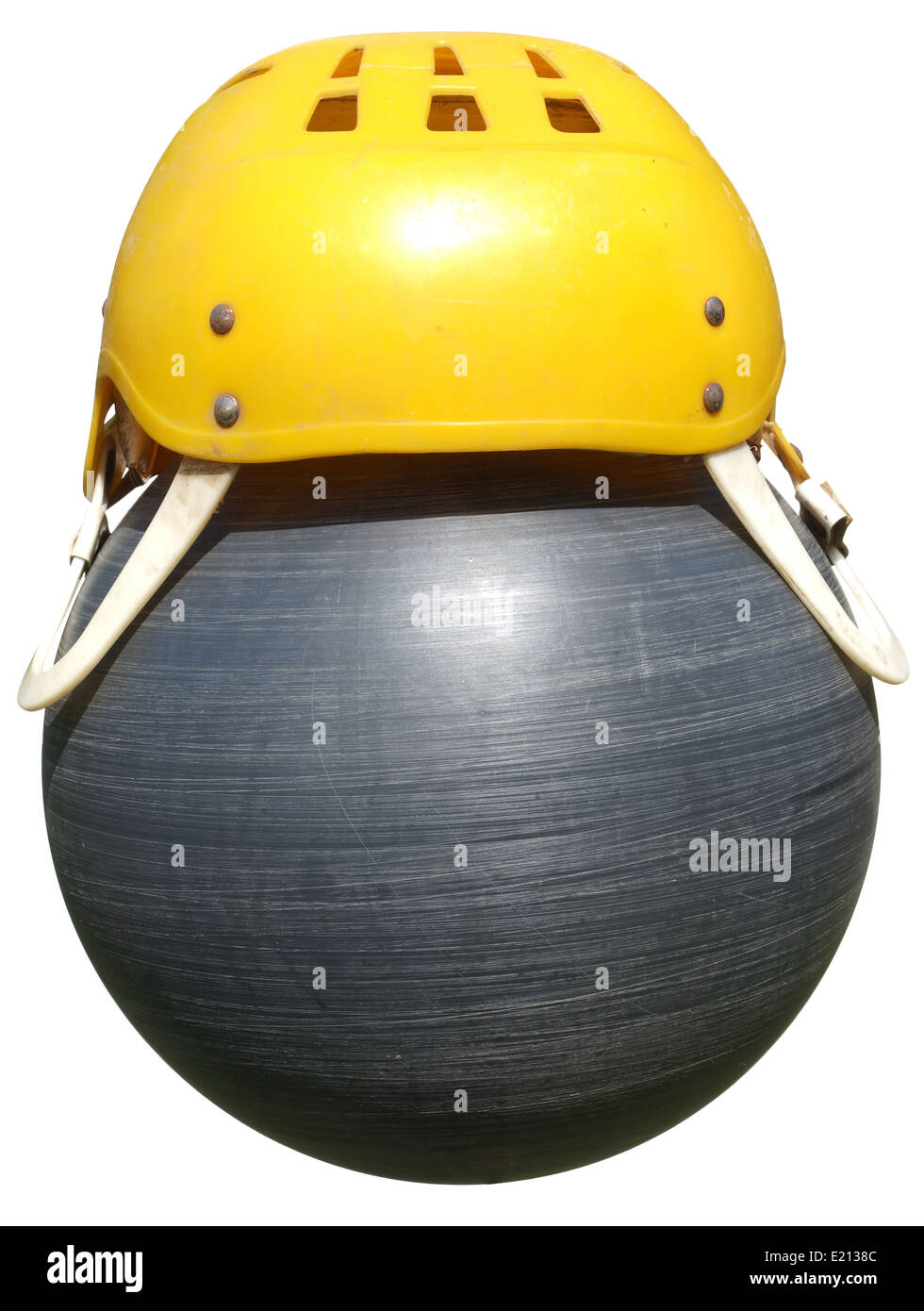 Yellow sports helmet on a plastic ball black isolated on white ...