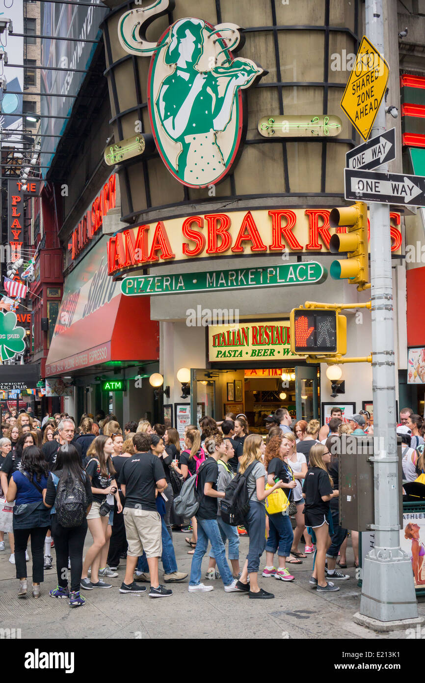 Throngs of tourists pass a Mama Sbarro's restaurant in Times Square in ...
