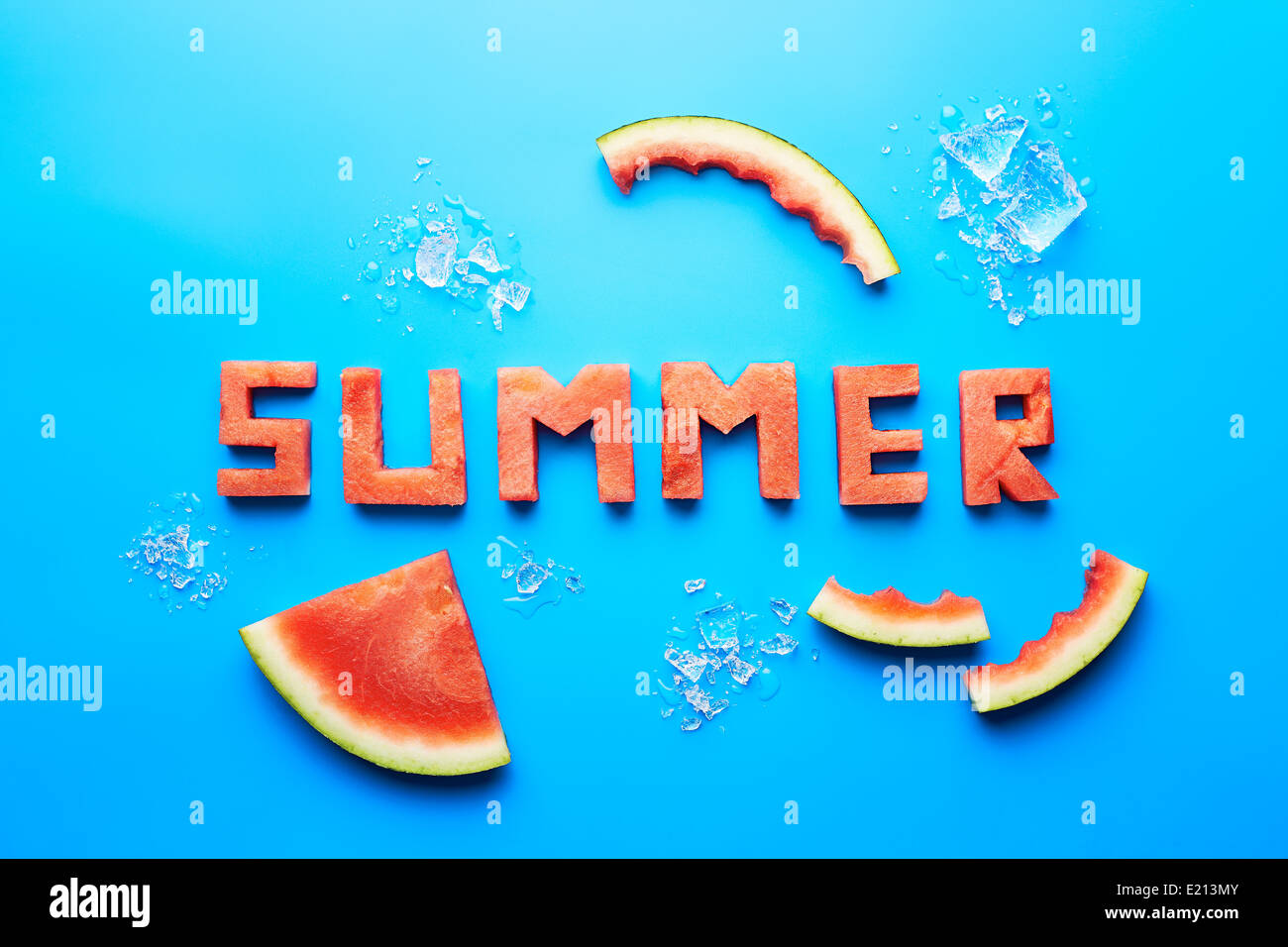 Summer word written with watermelon on blue background Stock Photo - Alamy