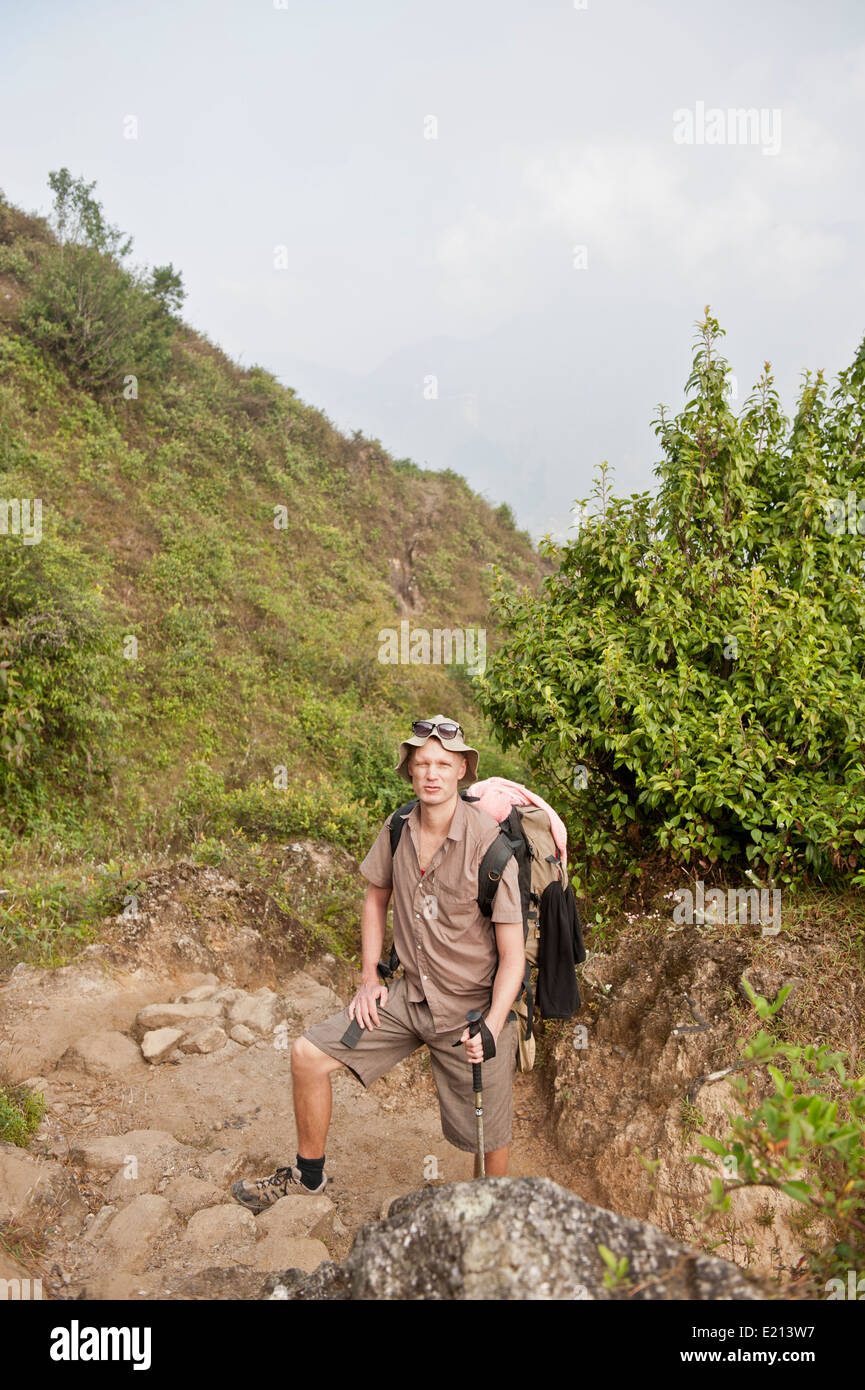 Male tourist climbing Himalayan mountain range in Nepal Stock Photo - Alamy