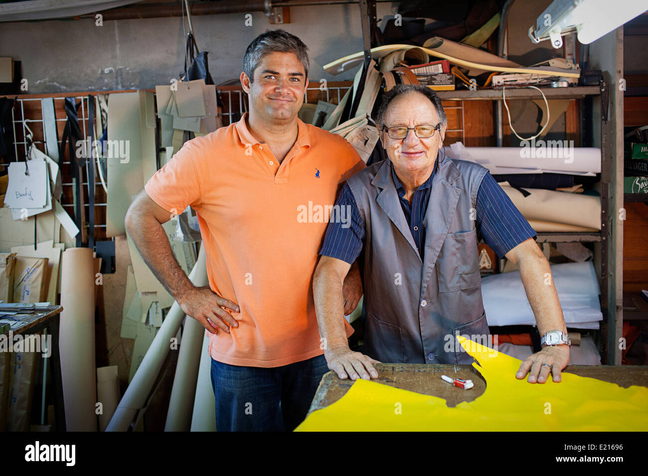 Elderly Italian father and middle aged son pose for a family photo in ...