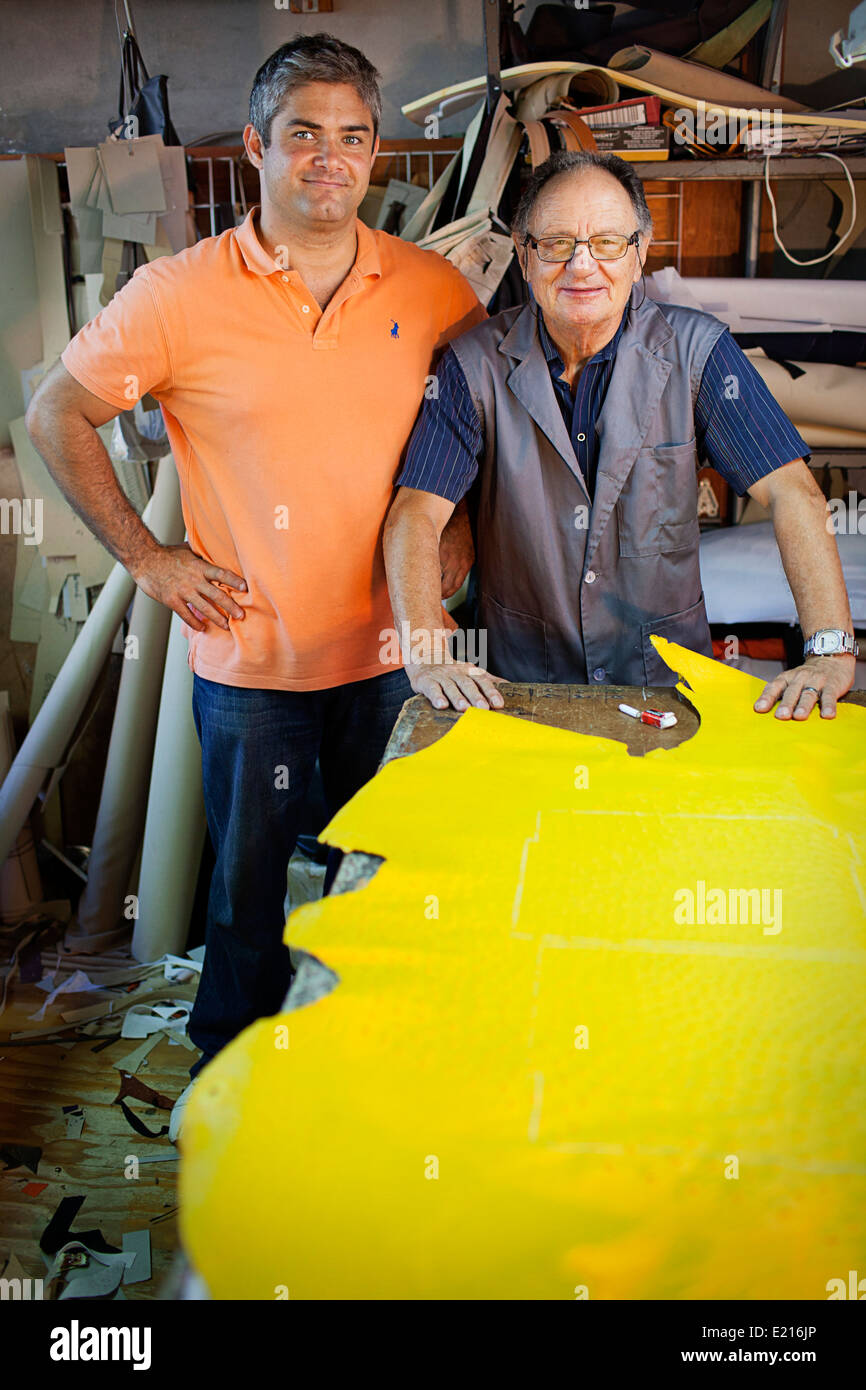 Elderly Italian father and middle aged son pose for a family photo in ...