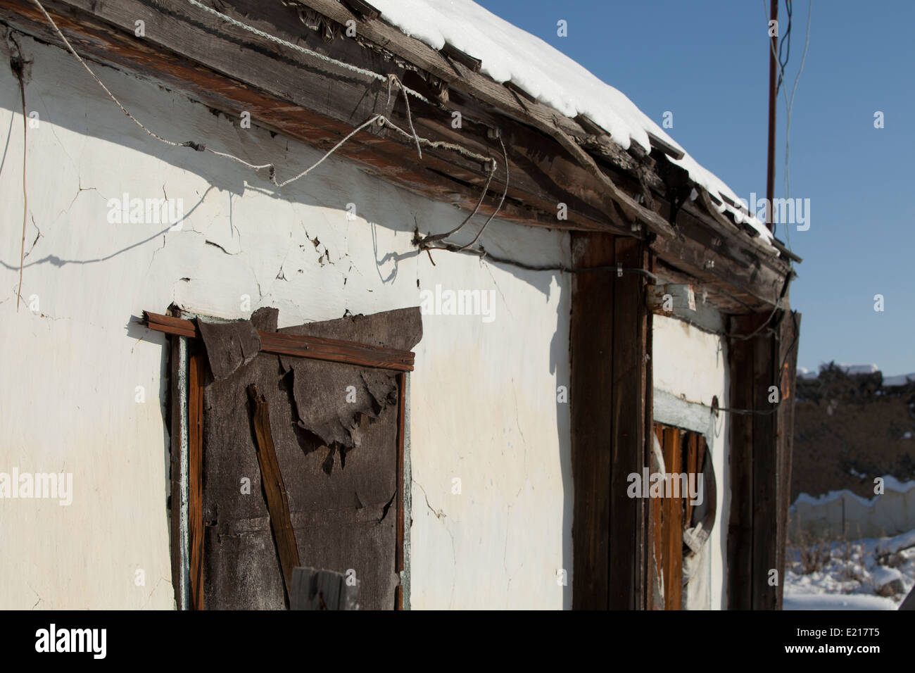 snow covered house urban decay broken window wooden Stock Photo - Alamy