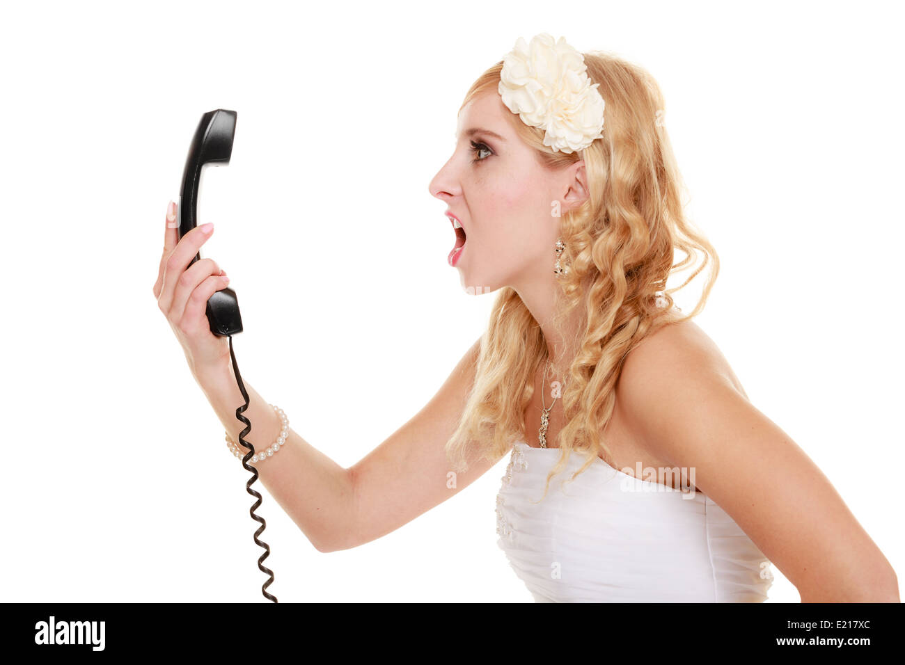 Wedding relationship difficulties. Angry woman talking on the phone ...