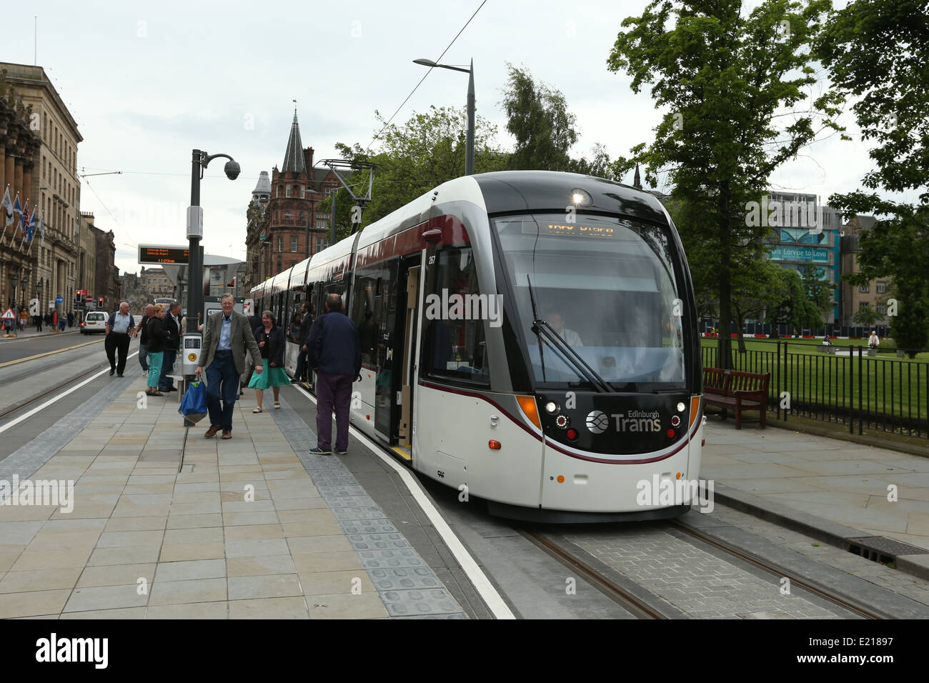 Image of the new Edinburgh Trams service in operation at a stop on a ...