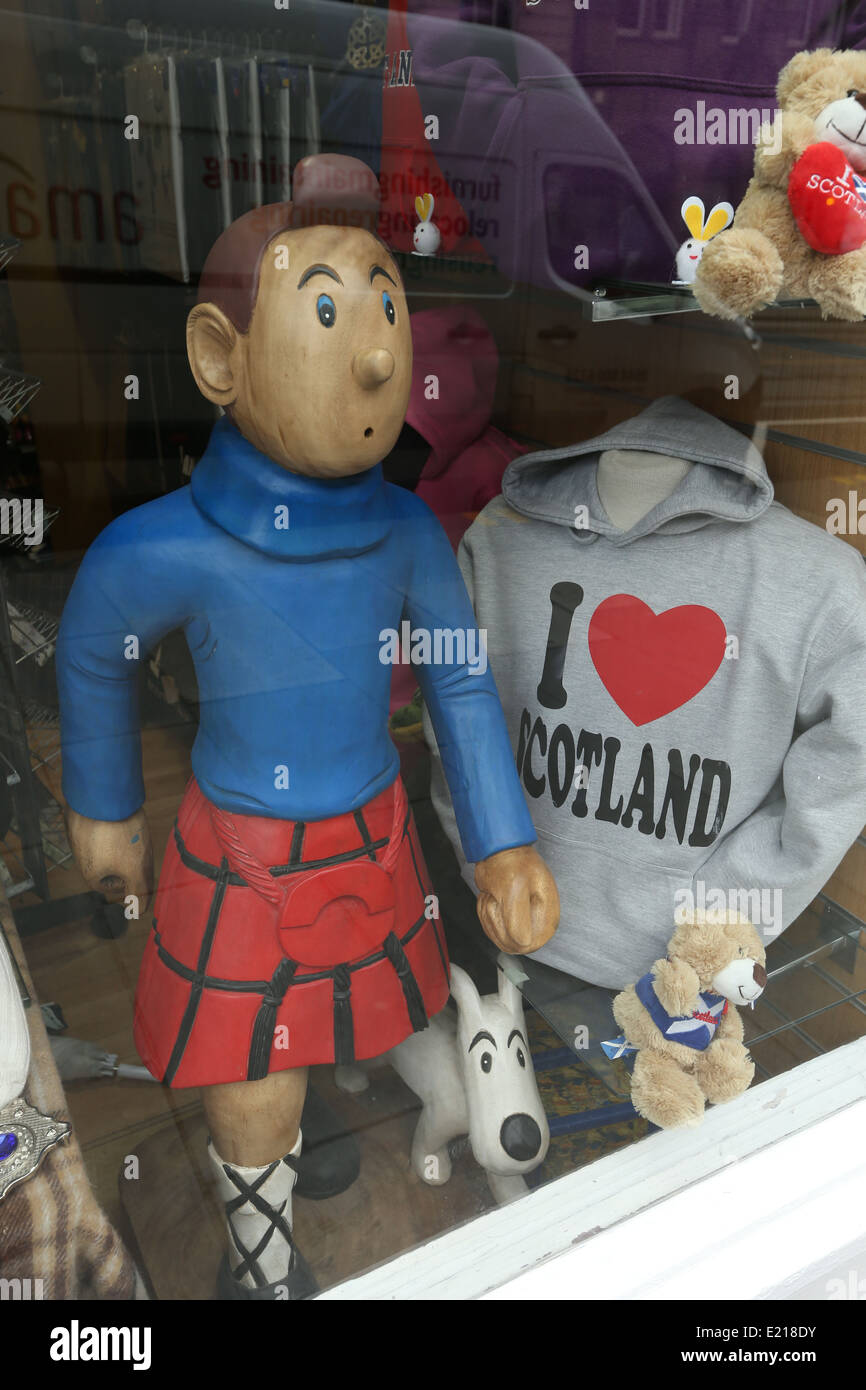A model of comic book character Tintin dressed in a kilt beside ...