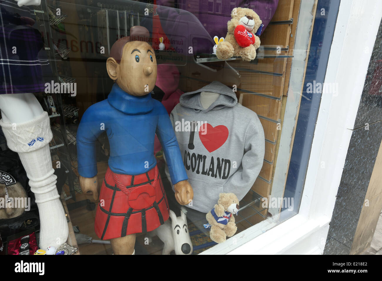 A model of comic book character Tintin dressed in a kilt beside ...