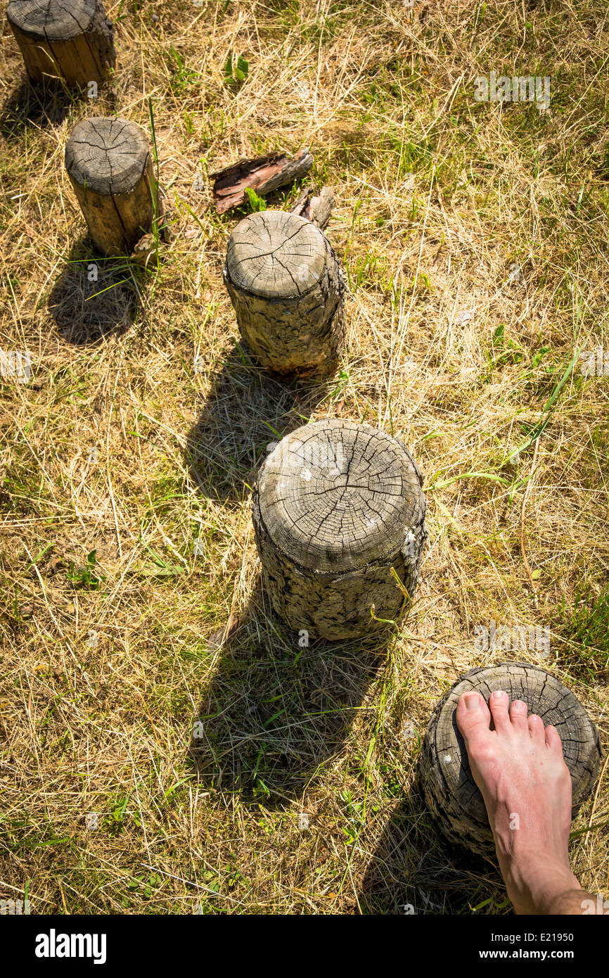 Balancing With Cautious Steps Over Wooden Obstacles Stock Photo - Alamy