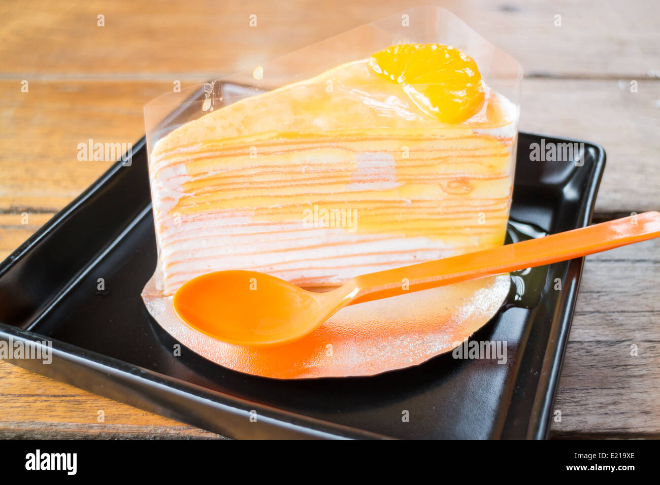Delicious fresh orange crepe cake with sauce, stock photo Stock Photo ...