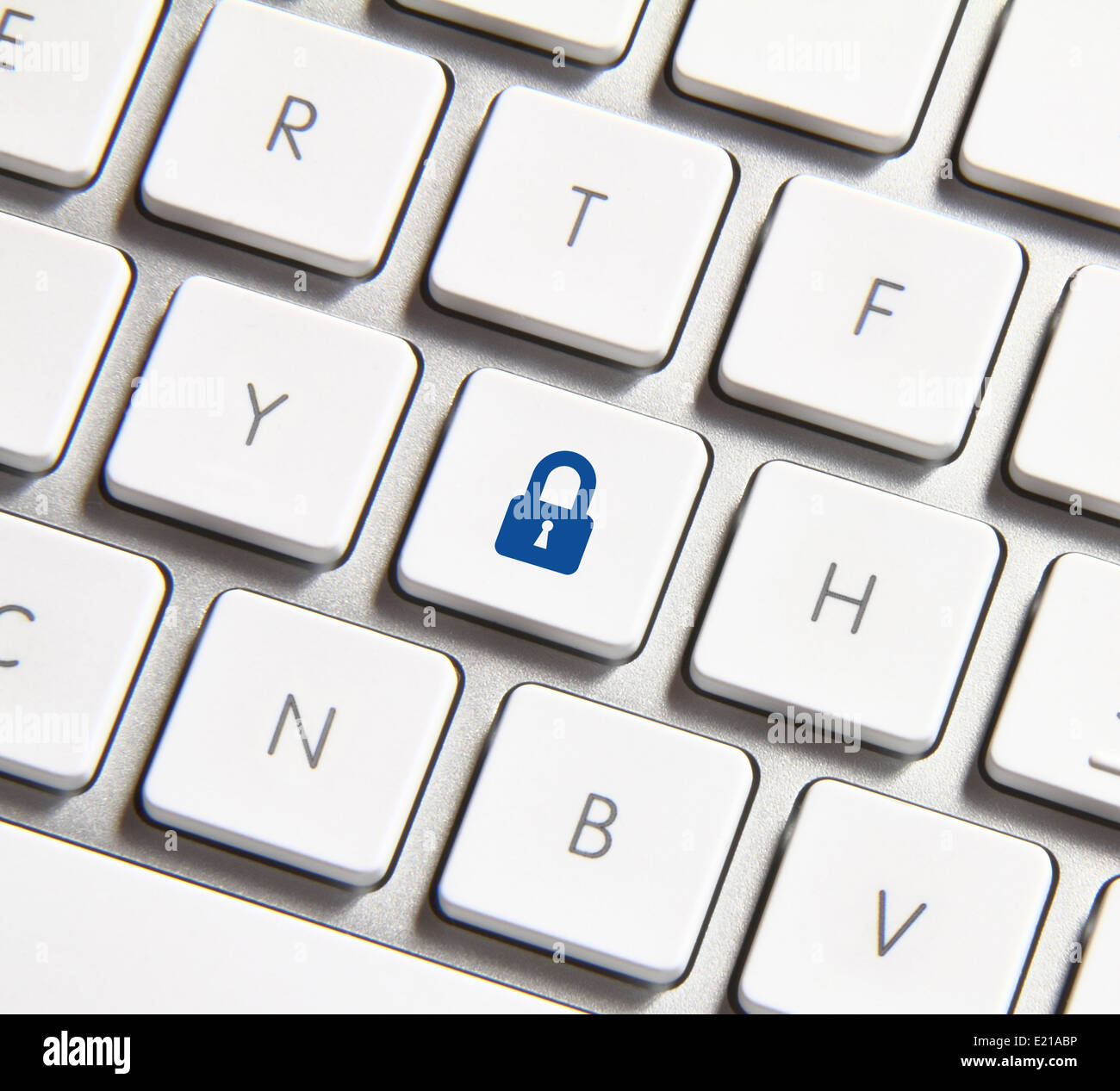 Photo of lock symbol button on the white keyboard Stock Photo - Alamy