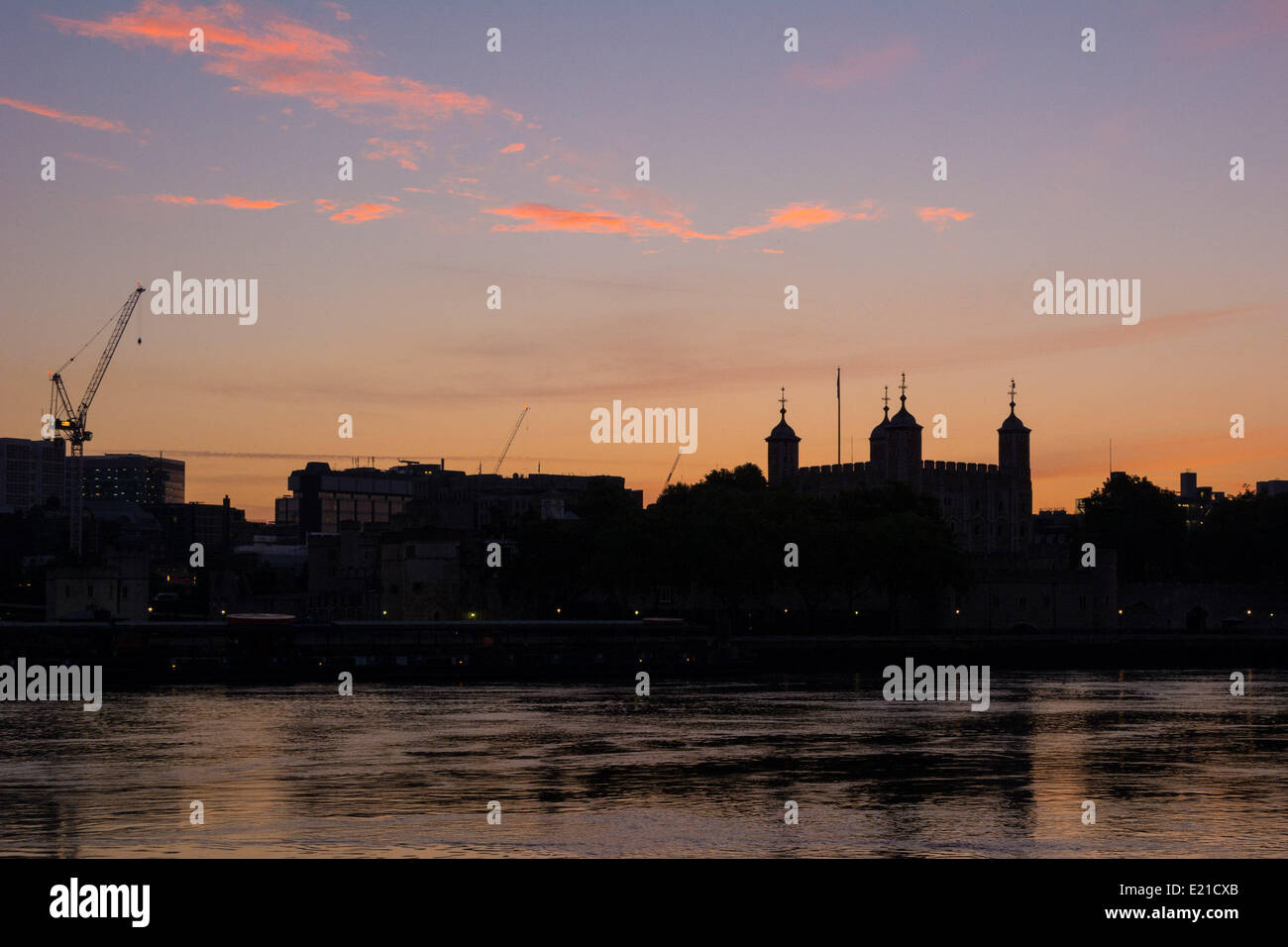London, UK 13th June, 2014. Pre-dawn light glows in the sky behind the ...