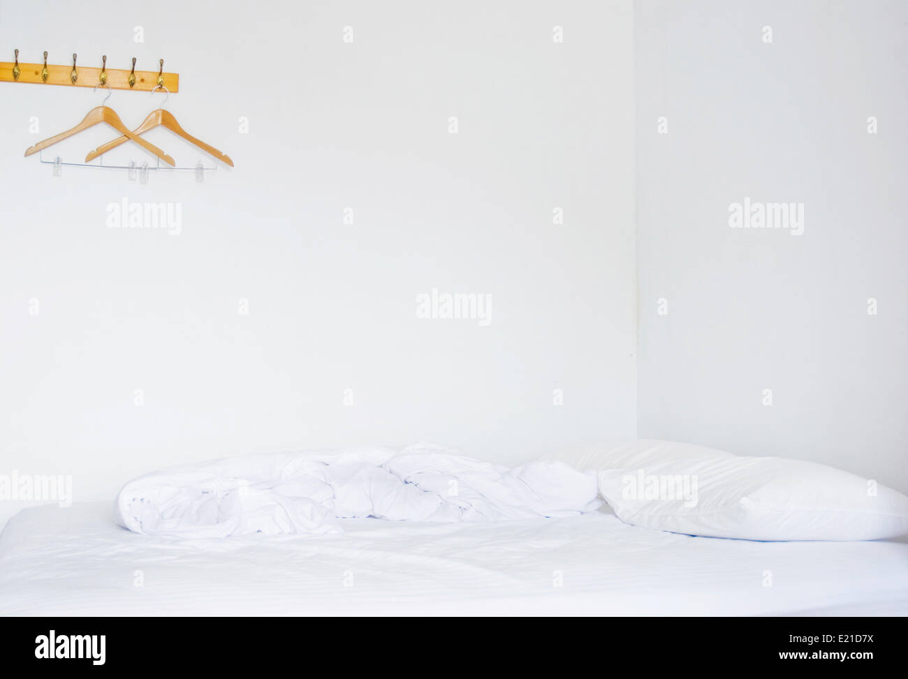 Pillows and bed in empty bedroom Stock Photo - Alamy