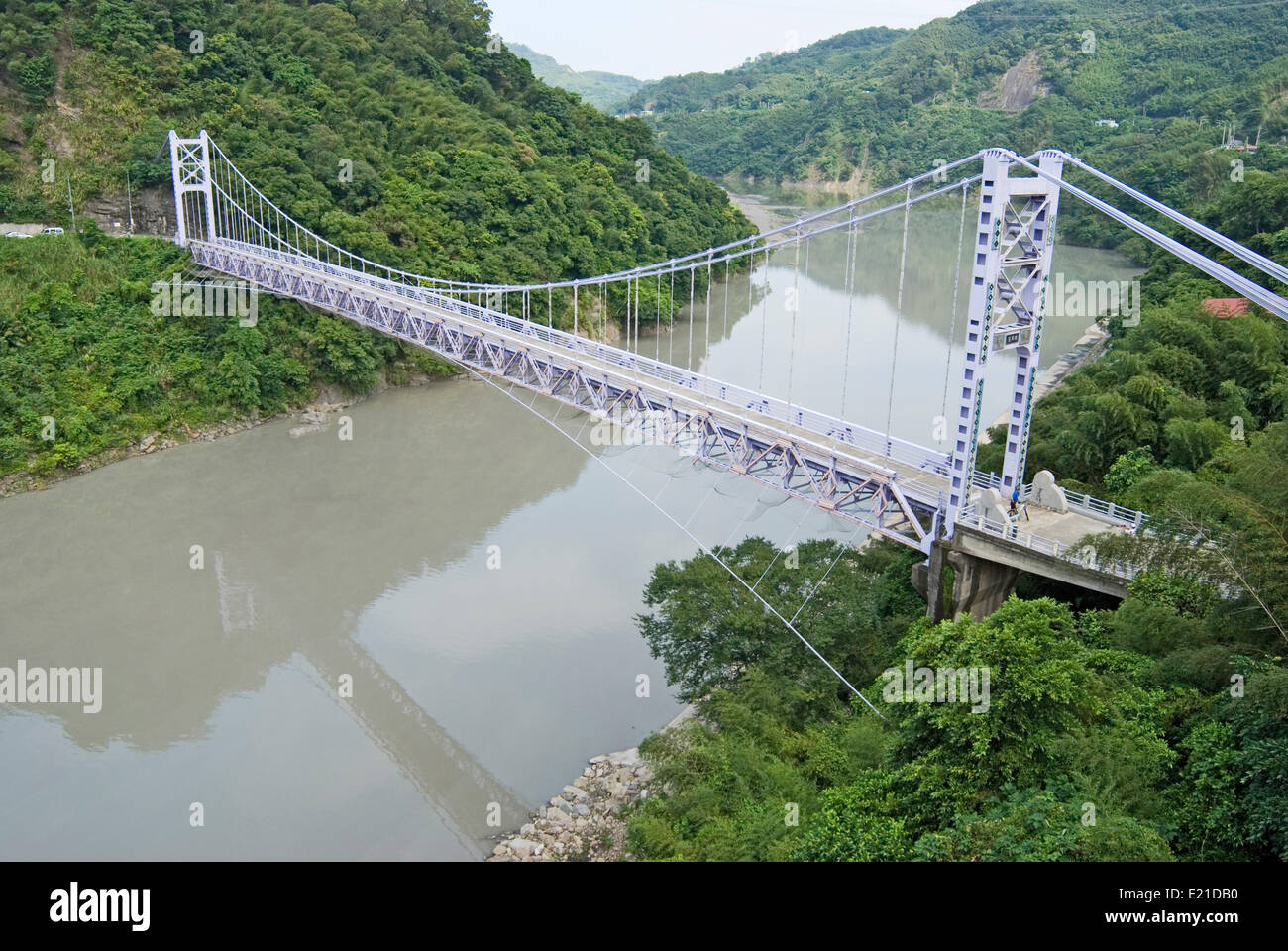 Suspension bridge btween mountains Stock Photo - Alamy