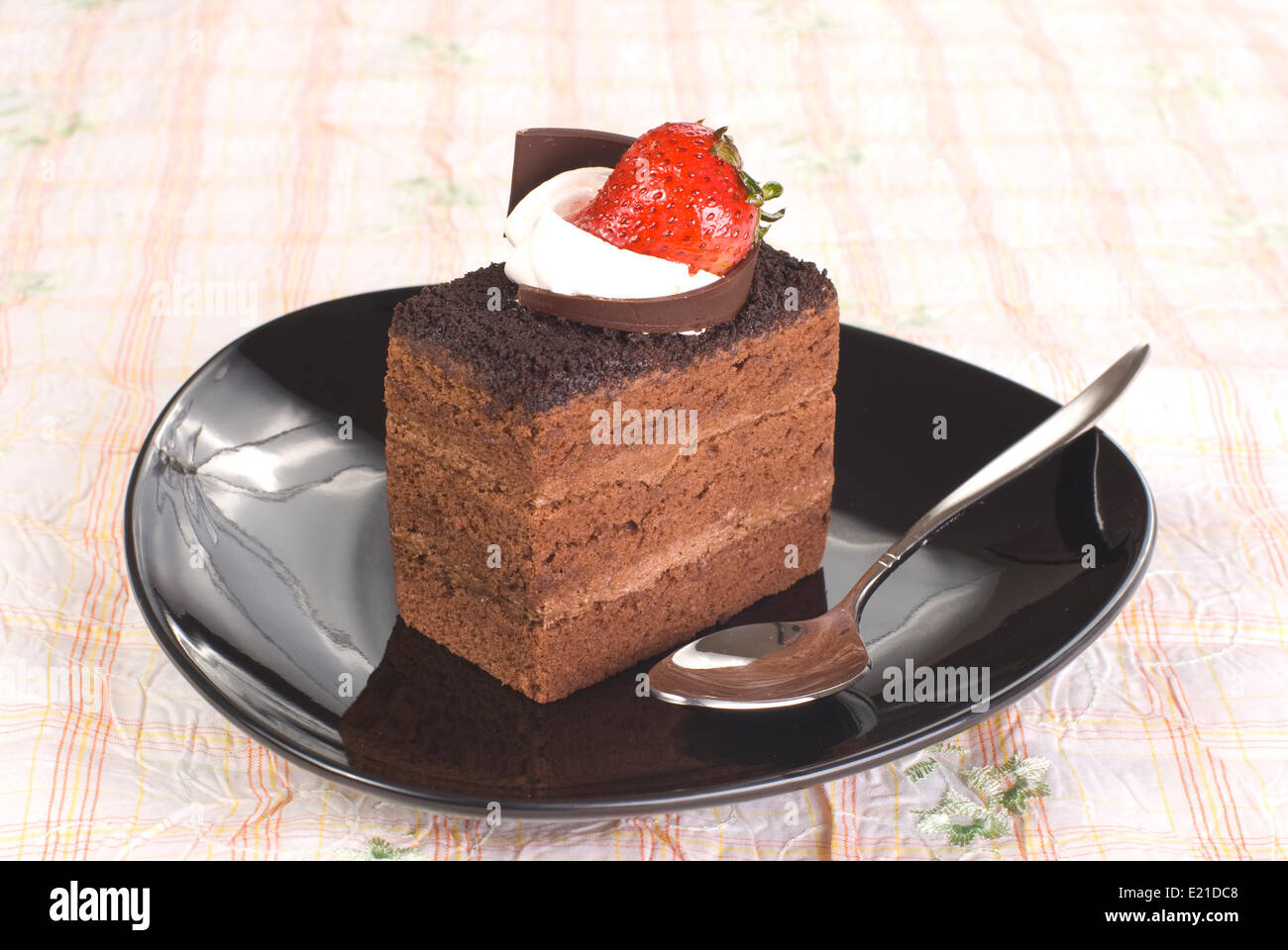 Piece of Chocolate cake with strawberry Stock Photo - Alamy