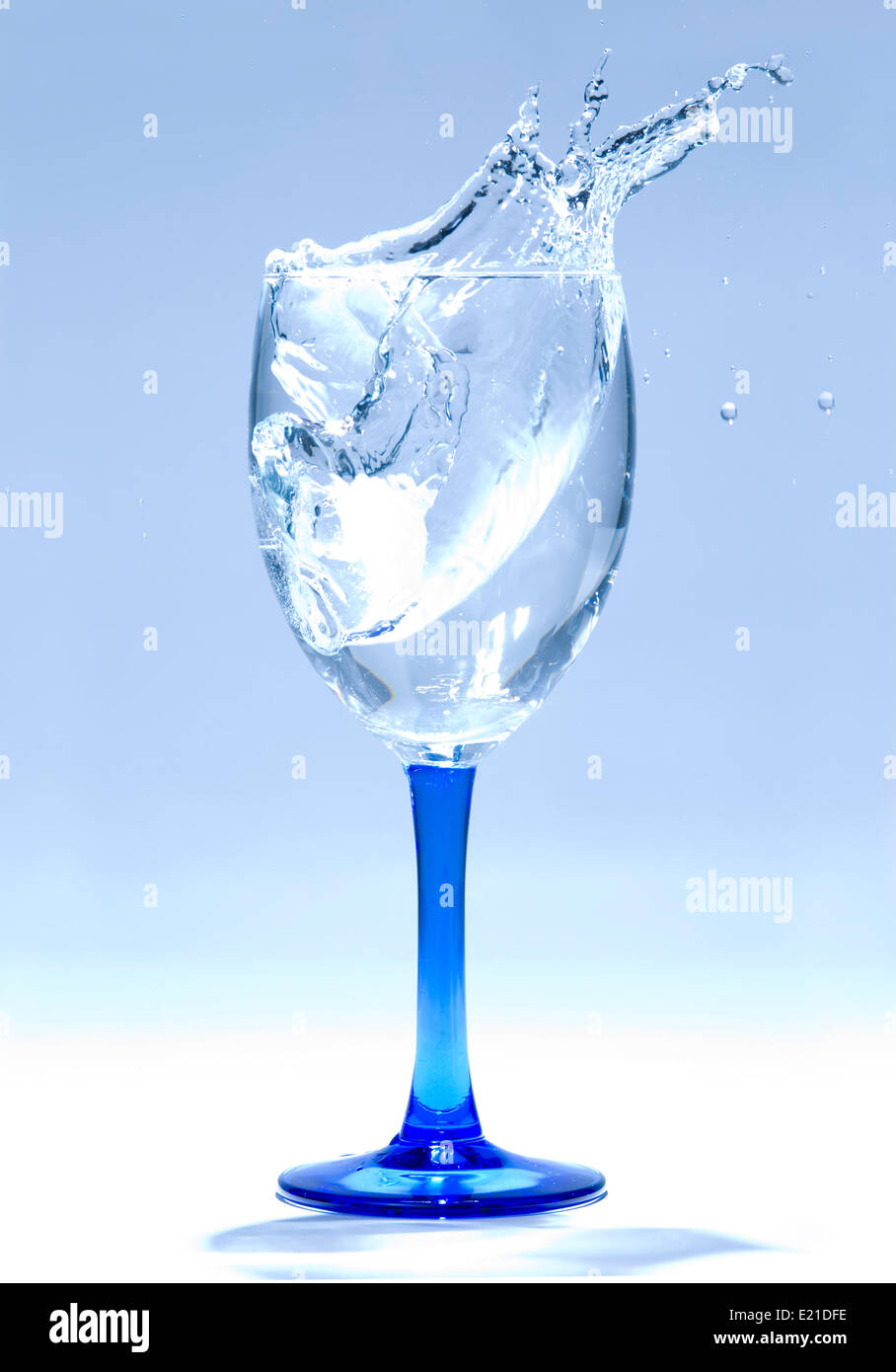 ice splashing water in glass Stock Photo - Alamy