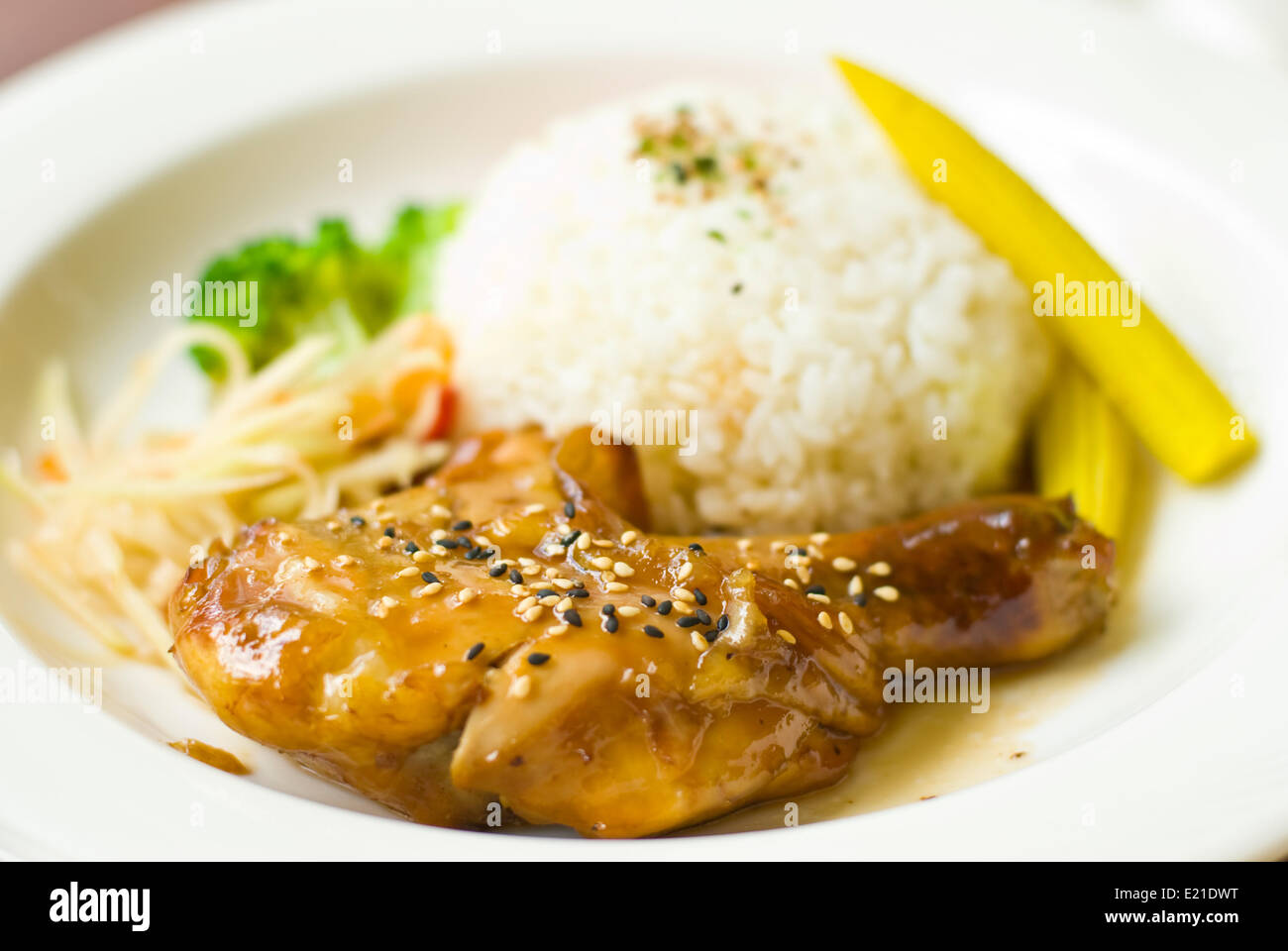 Roast chicken and rice in dish Stock Photo - Alamy