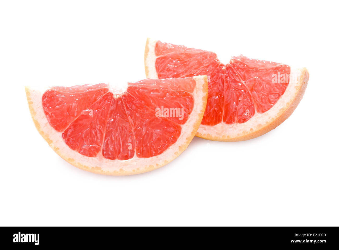 Two slices of grapfruit Stock Photo - Alamy