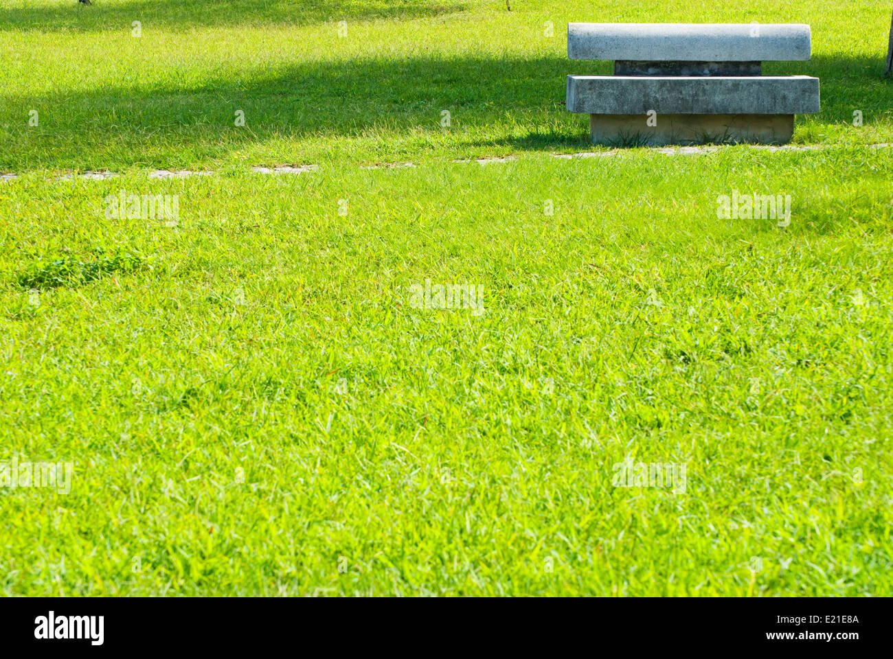 Stone walkway and stone bench Stock Photo - Alamy
