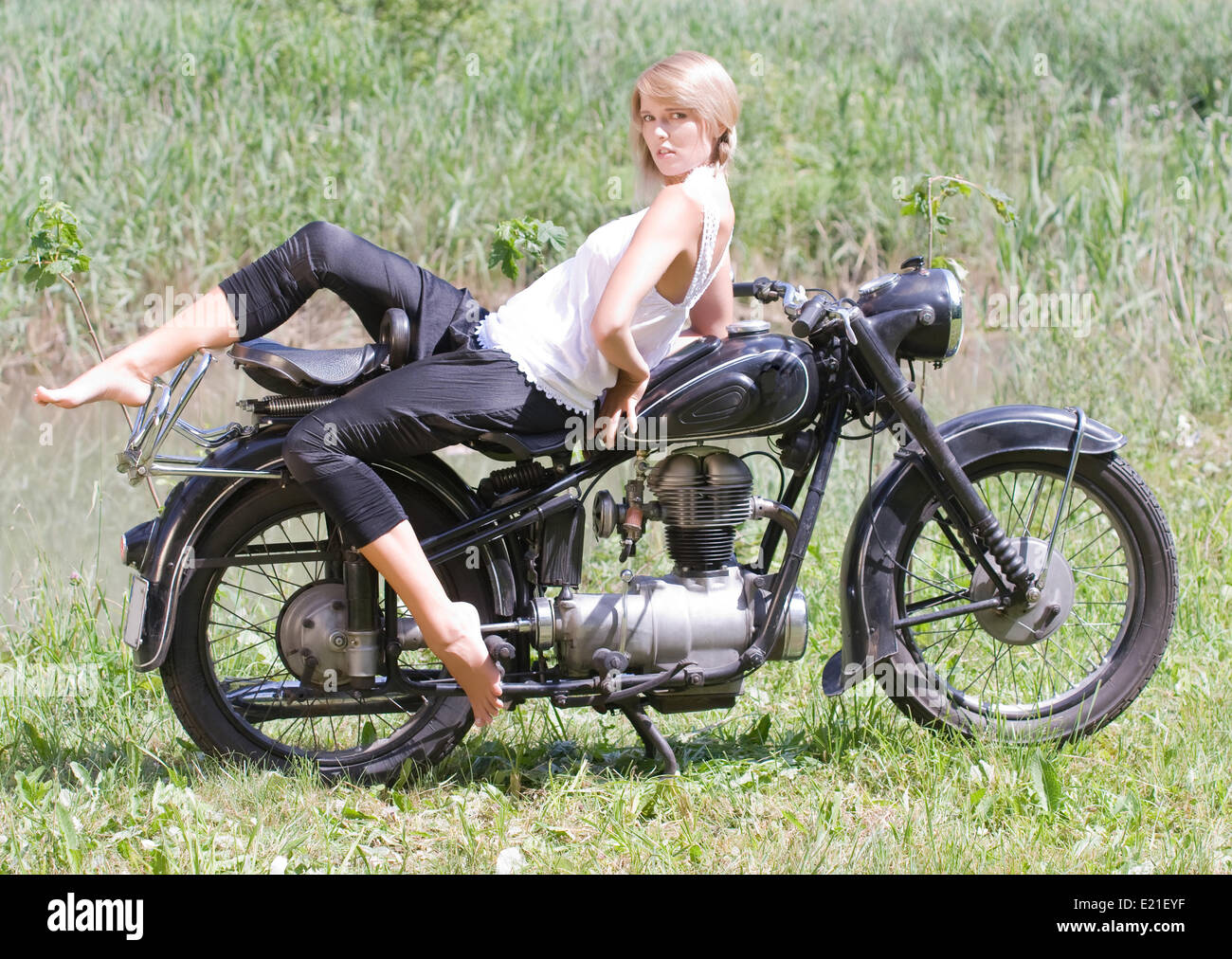 Woman pose motorcycle hi-res stock photography and images - Alamy