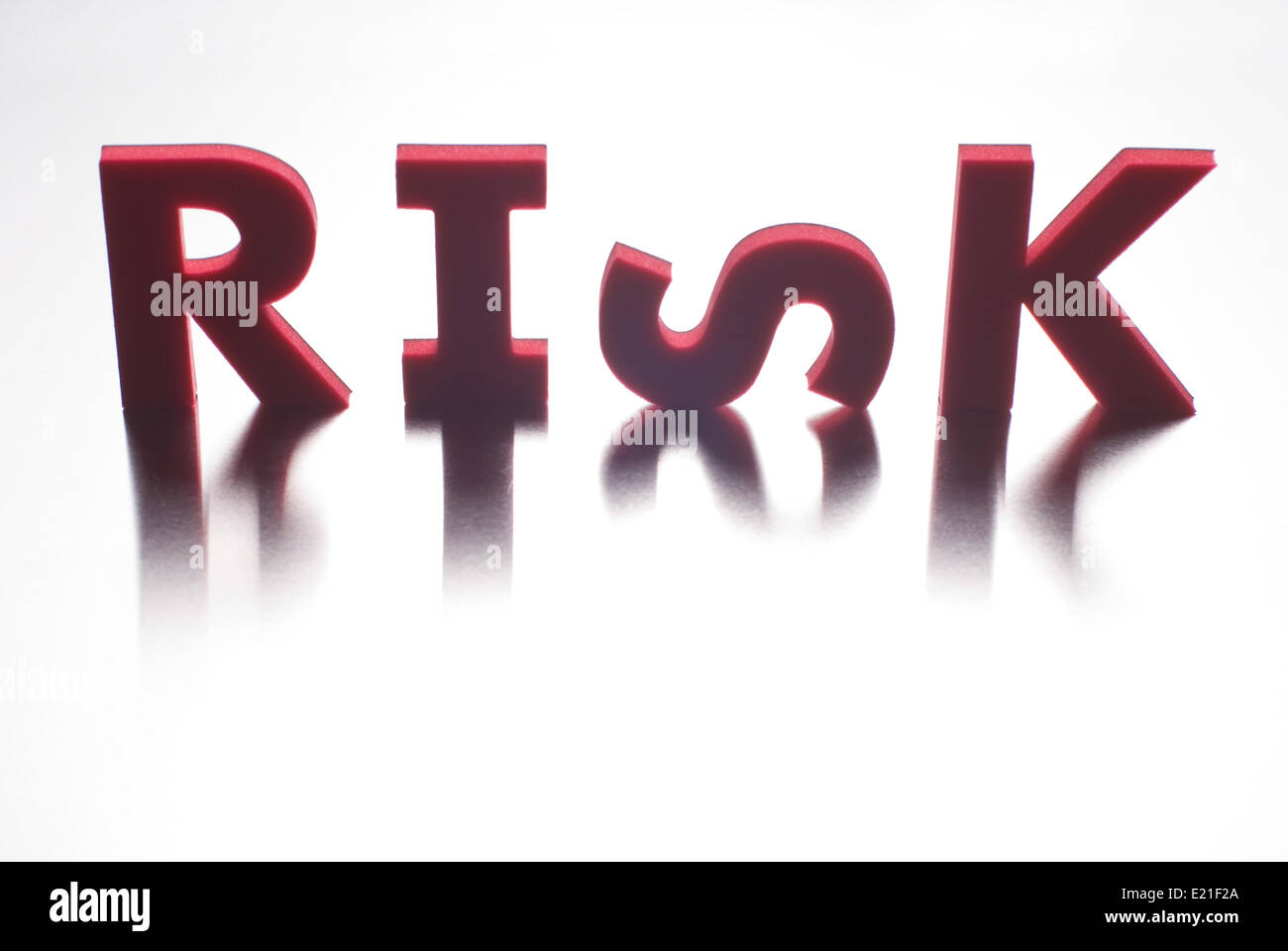 Risk word on metal background Stock Photo - Alamy