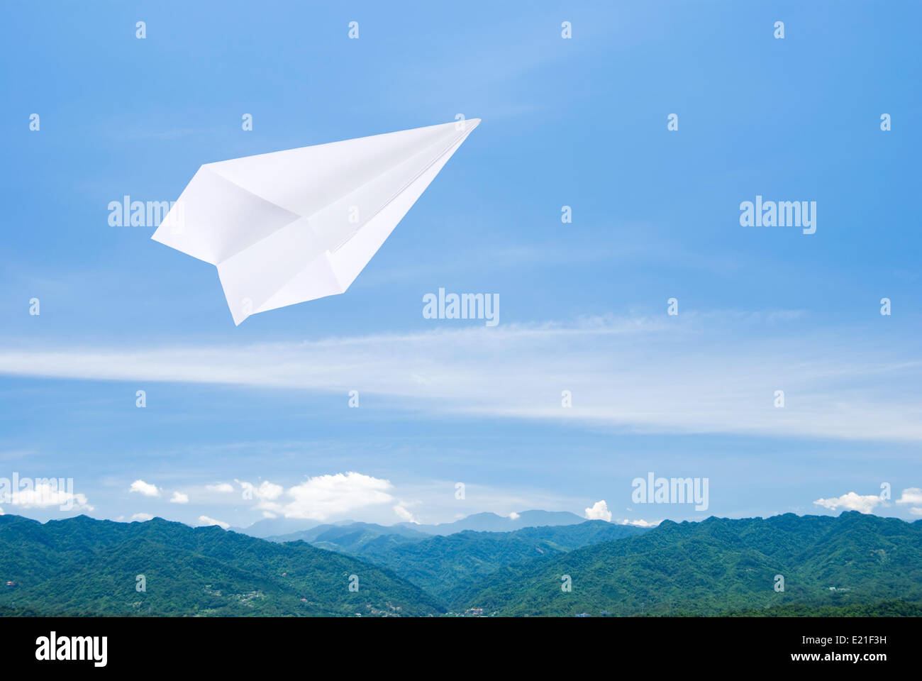 Paper airplane flying upon the mountain Stock Photo - Alamy