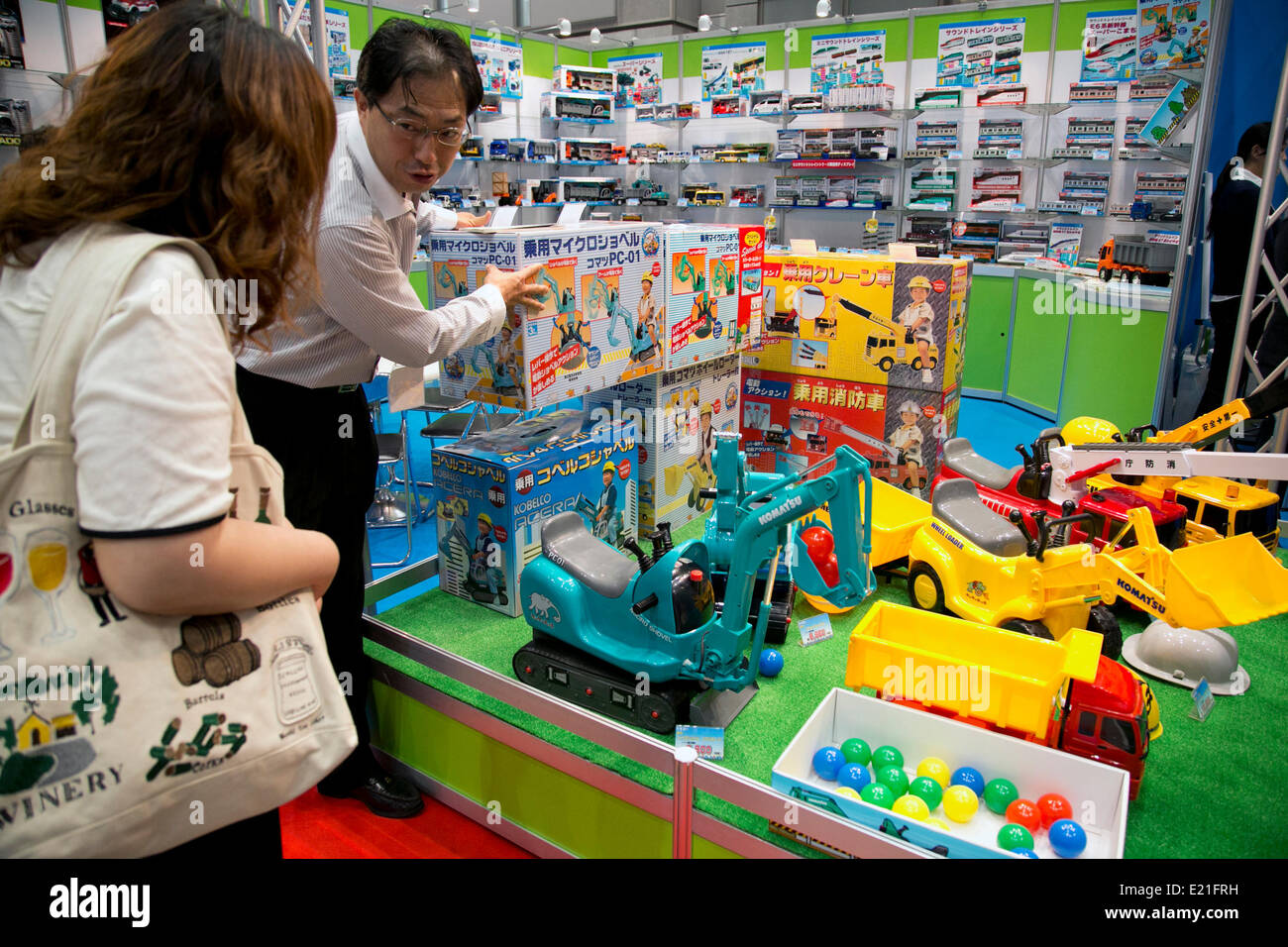 Tokyo, Japan. 13th June, 2014. An exhibitor introduces Komatsu toys ...