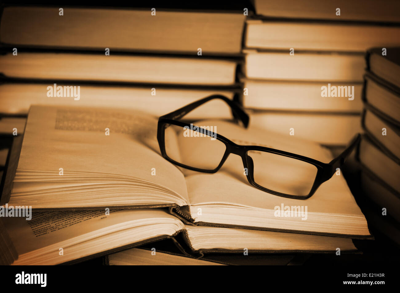Glasses on open book Stock Photo - Alamy
