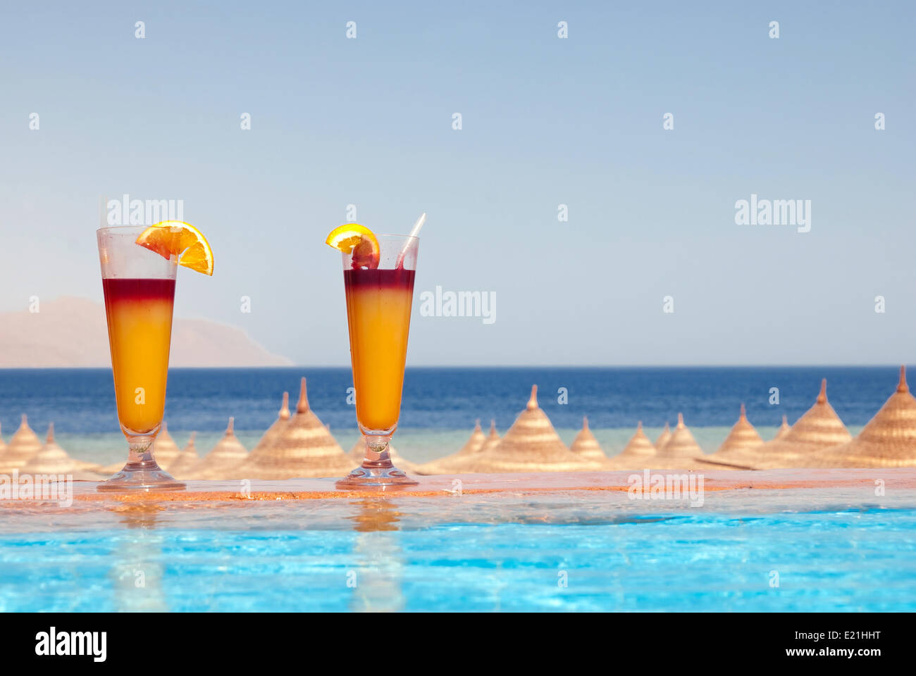 Cocktails at the pool Stock Photo - Alamy