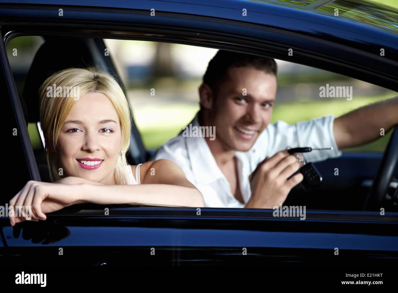 Happy owners of cars Stock Photo - Alamy