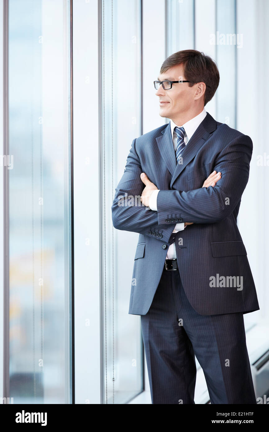 Business man at the window Stock Photo - Alamy