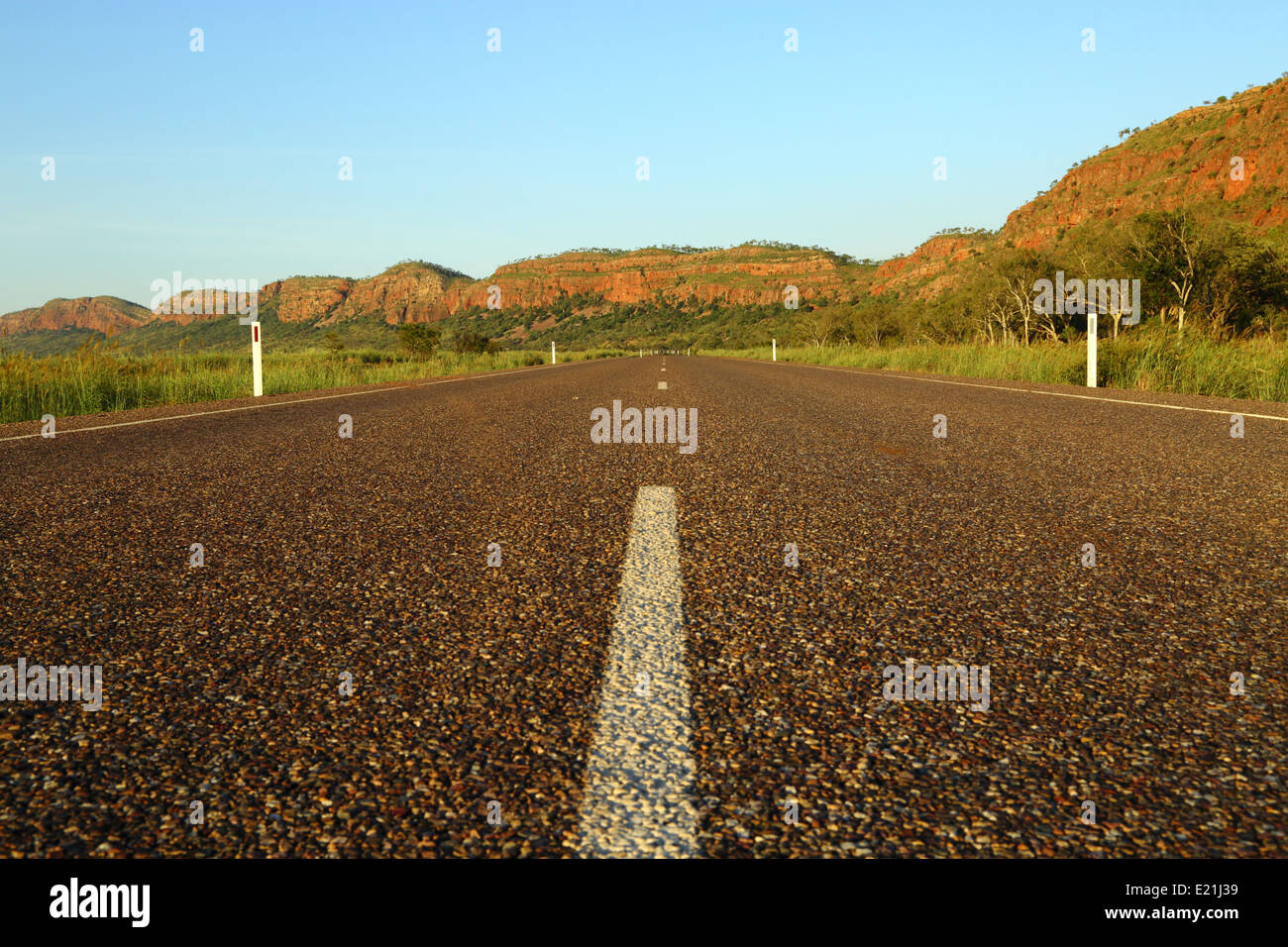 Low viewpoint of highway through a mountain range in The Kimberley ...
