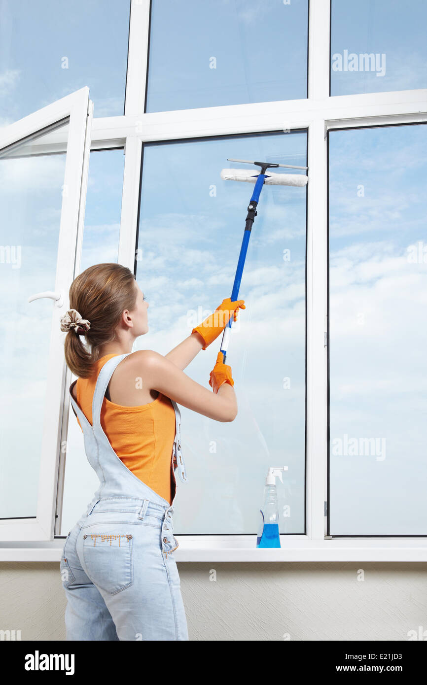 A young girl washes the window Stock Photo - Alamy