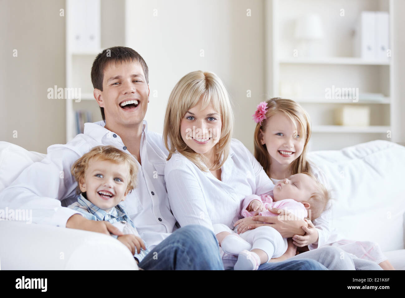 A happy family with three children at home Stock Photo - Alamy