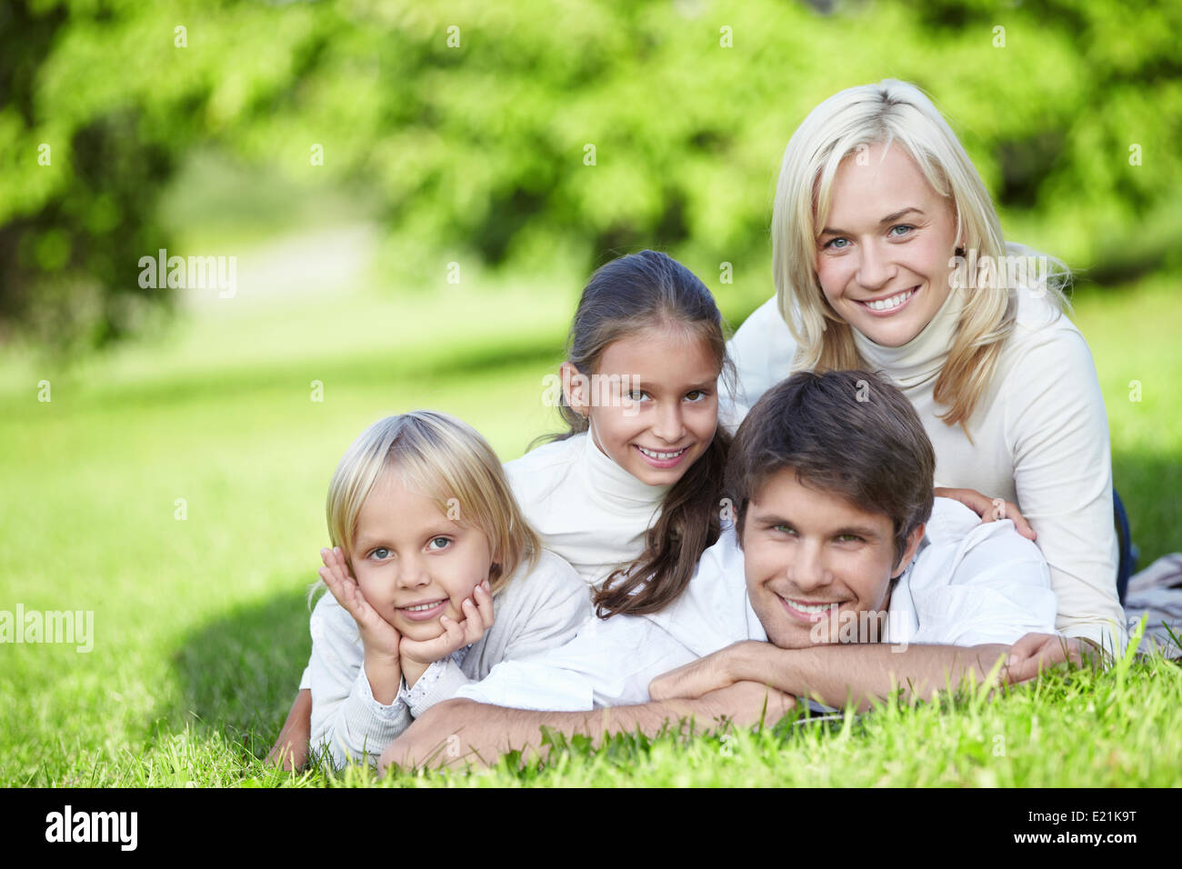 A happy family with two children outdoors Stock Photo - Alamy