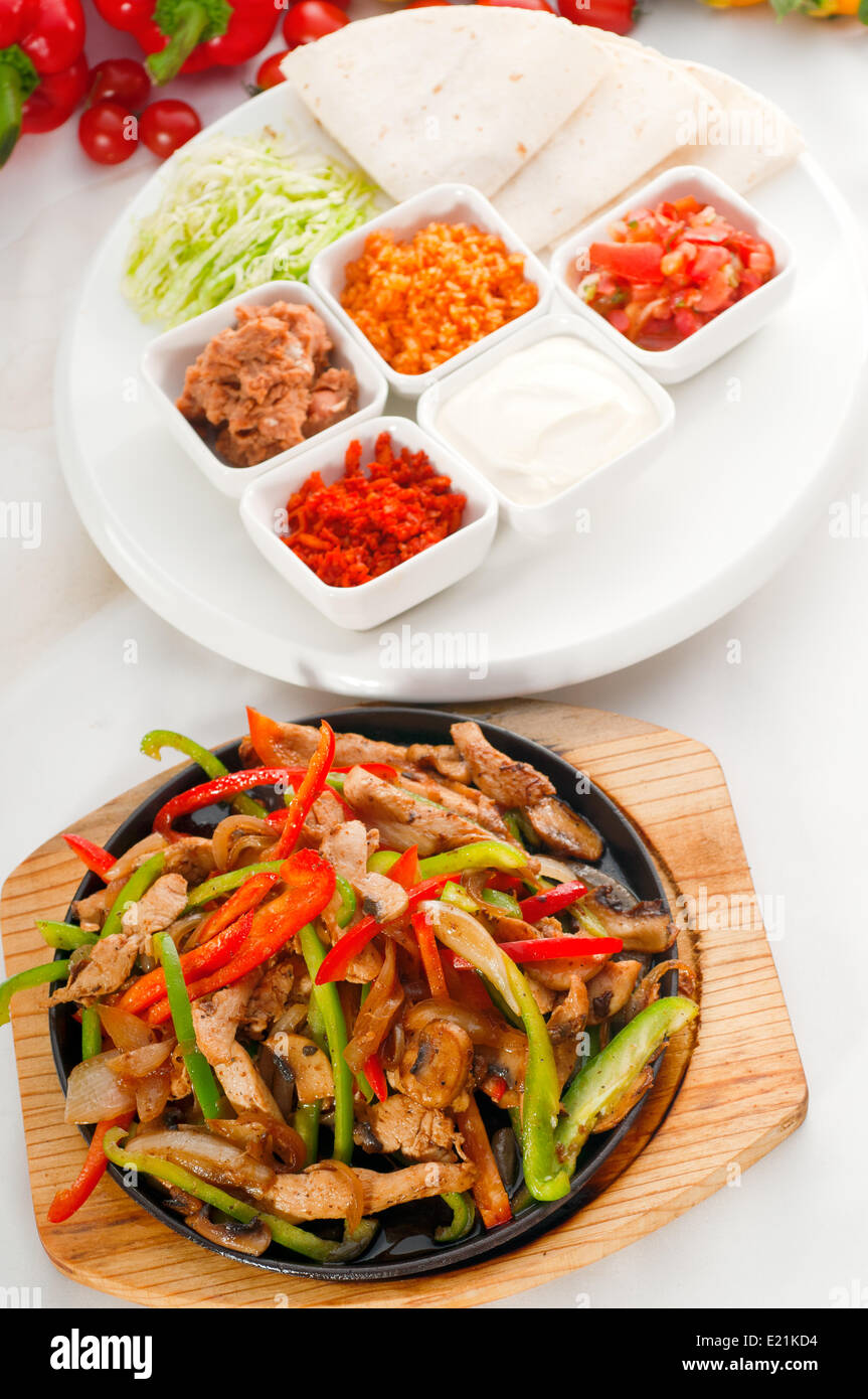 original fajita sizzling hot on iron plate Stock Photo - Alamy