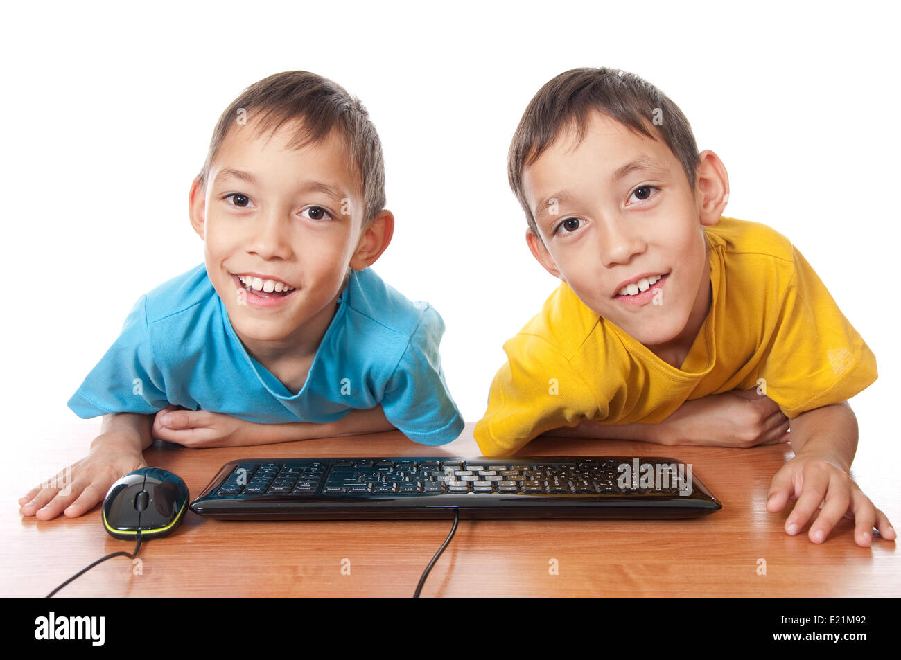 twins with computer mouse and keyboard Stock Photo - Alamy