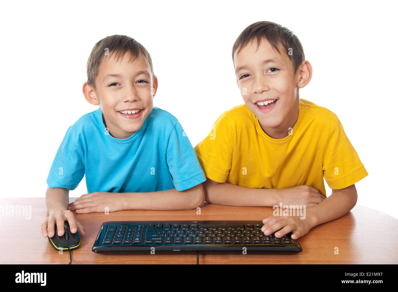 twins with computer mouse and keyboard Stock Photo - Alamy