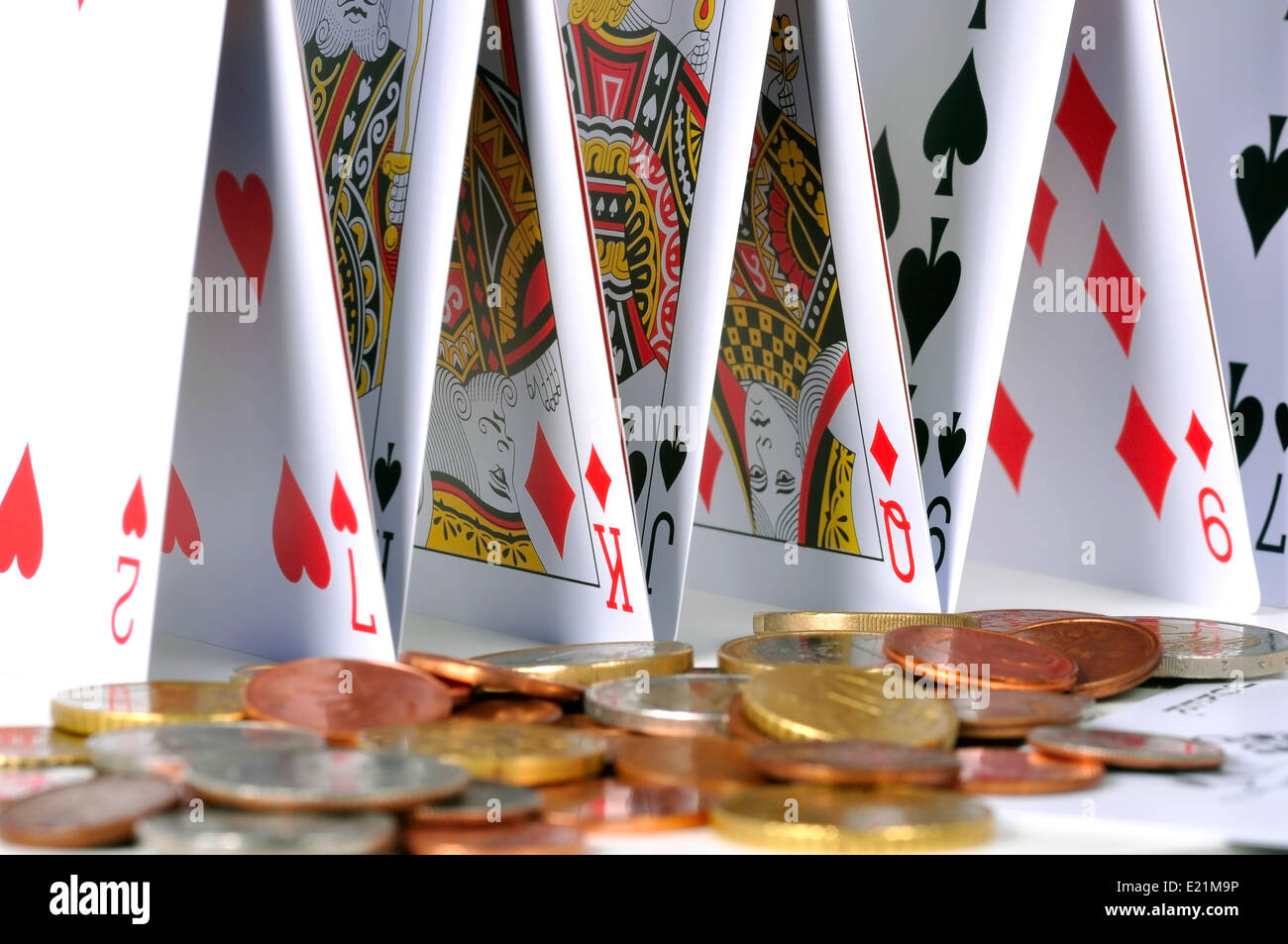 Castle of Cards and Coins Stock Photo - Alamy