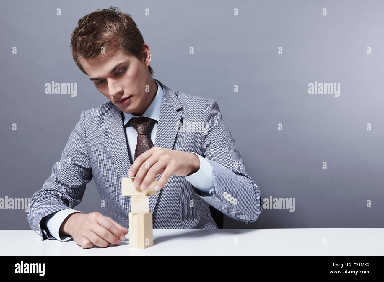A young man builds a structure Stock Photo - Alamy