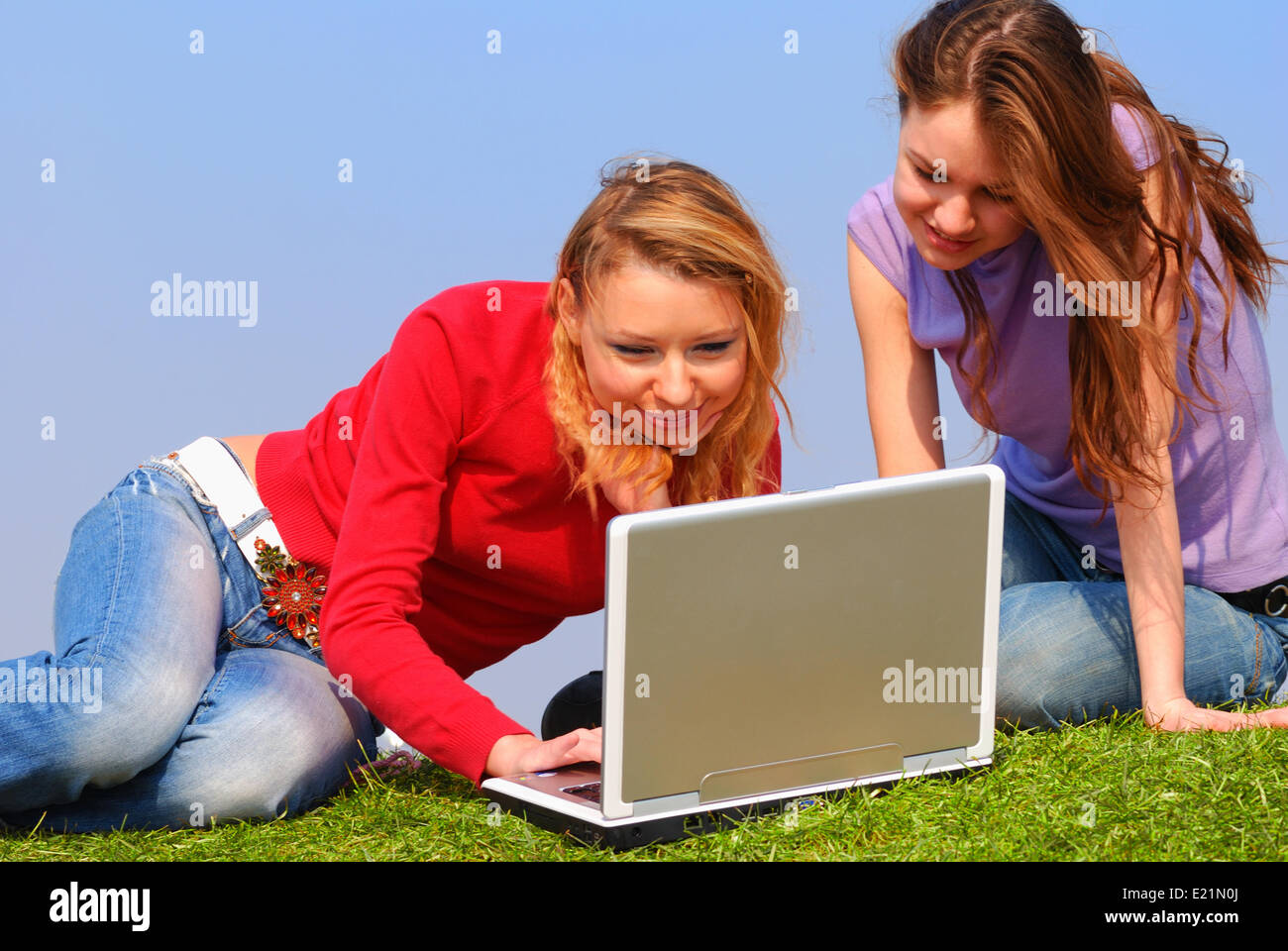 Girls with notebook Stock Photo - Alamy