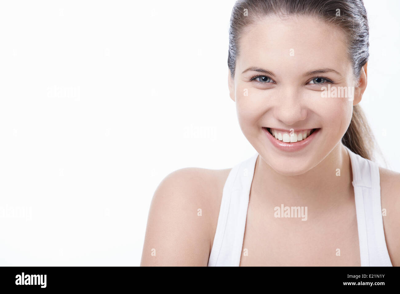Young smiling girl on white background Stock Photo - Alamy
